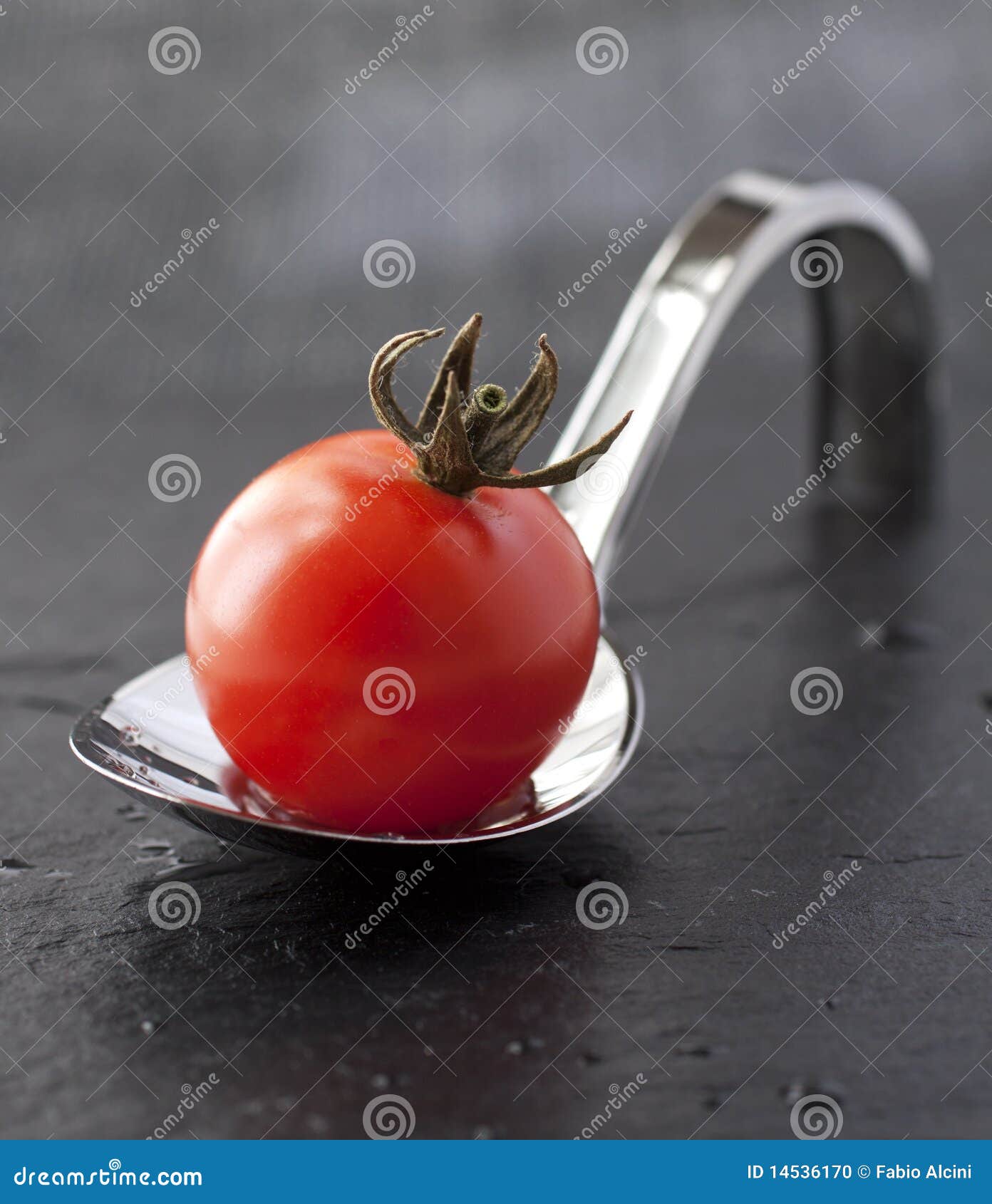 Tomato on spoon stock photo. Image of spoon, restaurant - 14536170