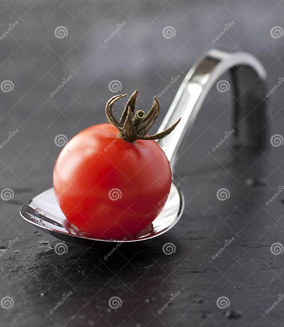 Tomato on spoon stock photo. Image of spoon, restaurant - 14536170