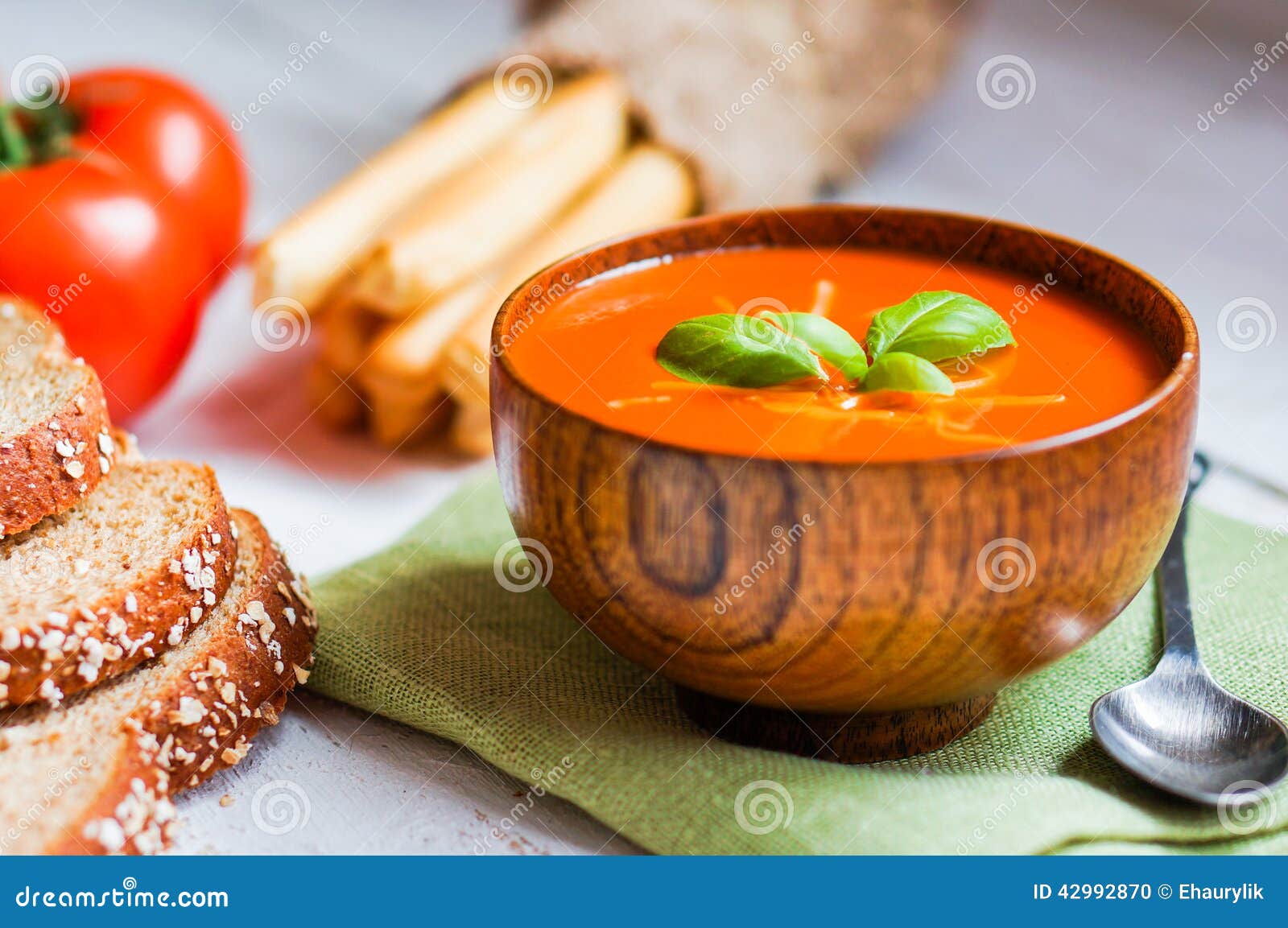 Tomatoe Soup with Bread Sticks and Basil on Wooden Background Stock ...