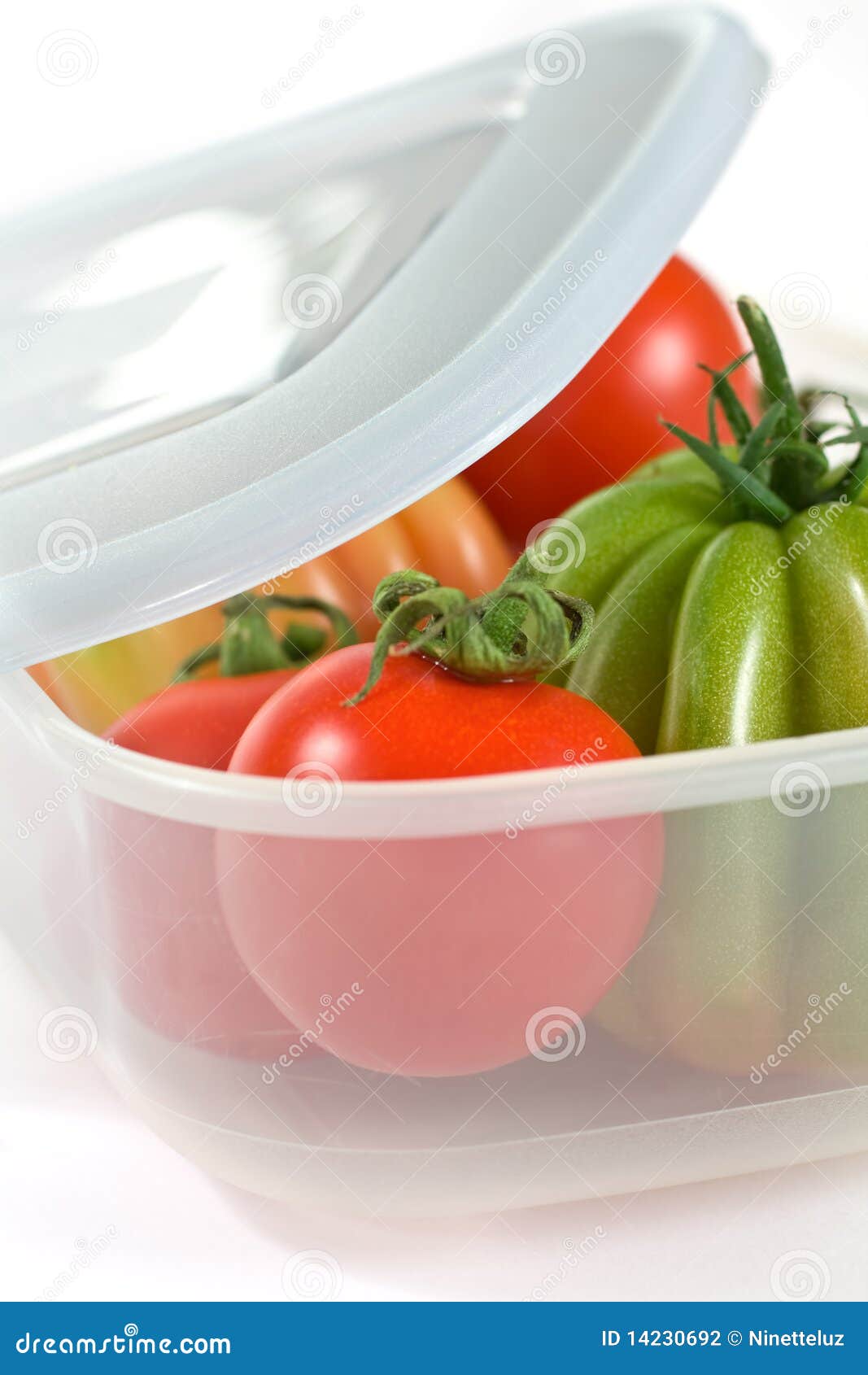 Tomatoes in a Plastic Box stock photo. Image of color - 14230692