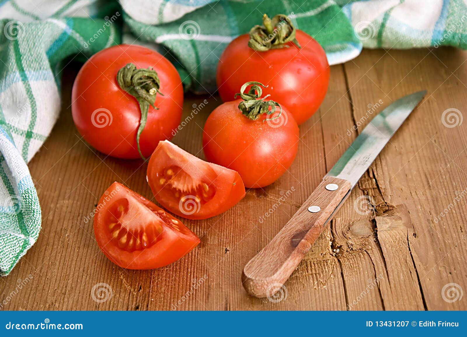 Tomatoes on wooden table stock image. Image of rustic - 13431207