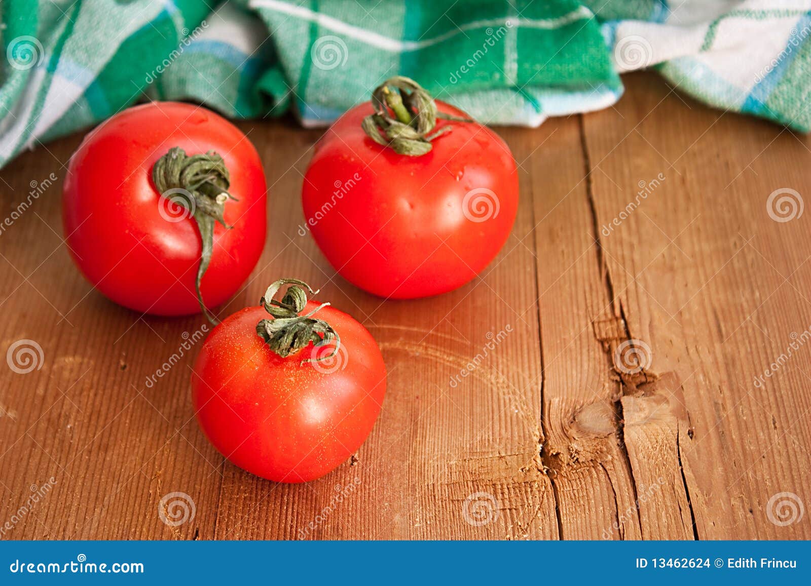 Tomatoes on wooden table stock photo. Image of hungry - 13462624