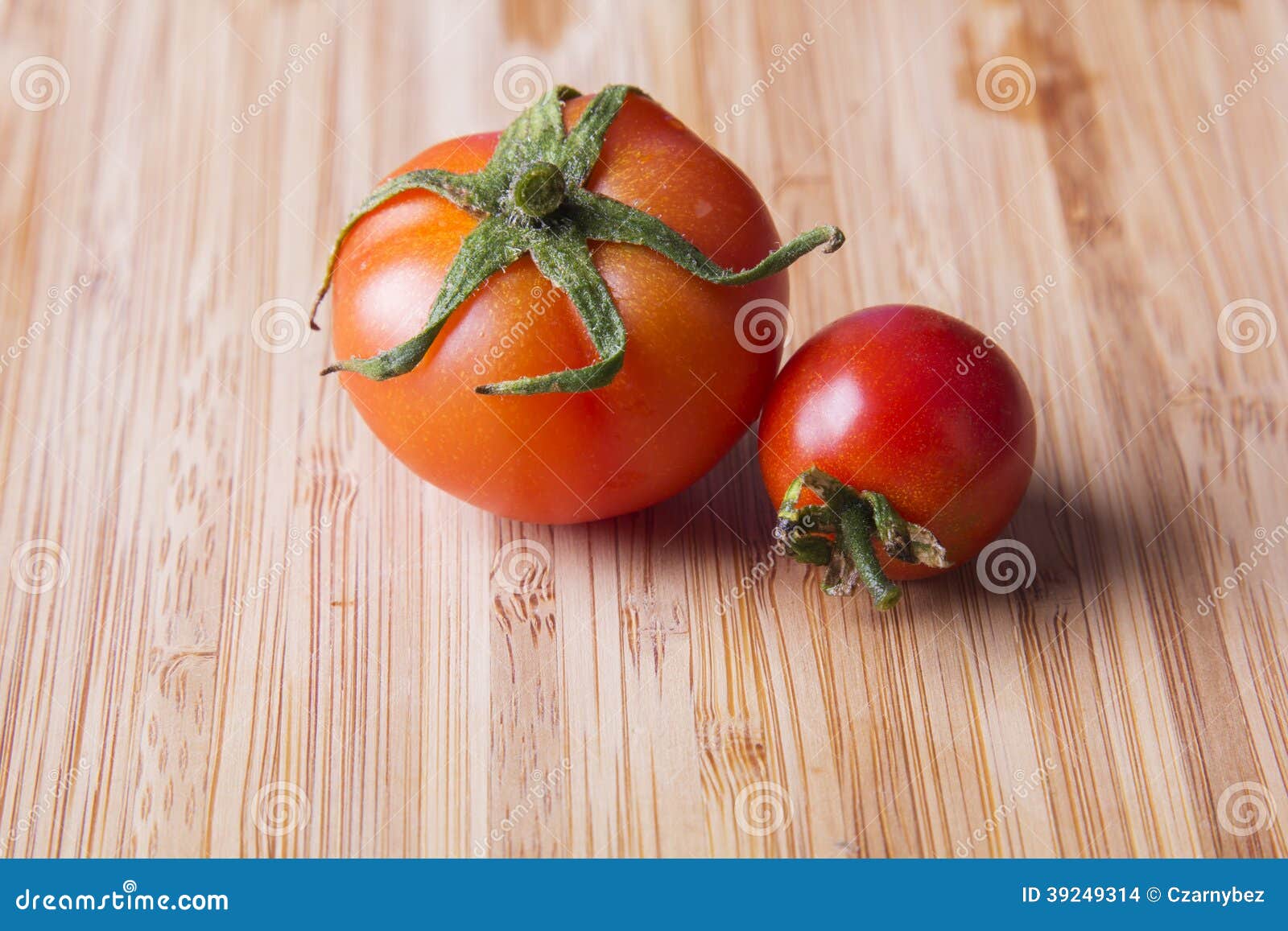 Tomatoes on a wooden table stock photo. Image of rustic - 39249314