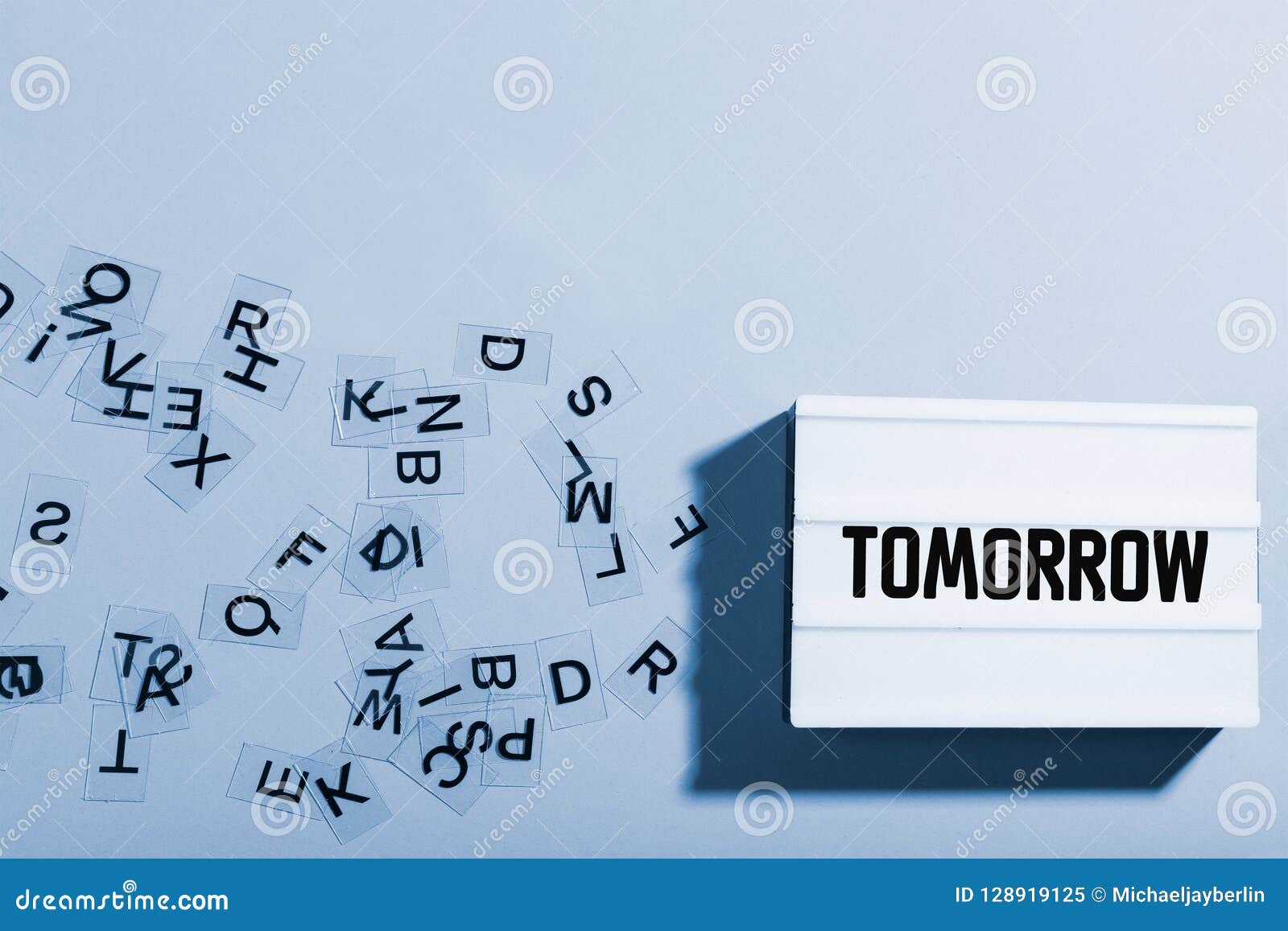 Tomorrow Word in Light Box with Author Text on Blue Background Stock ...