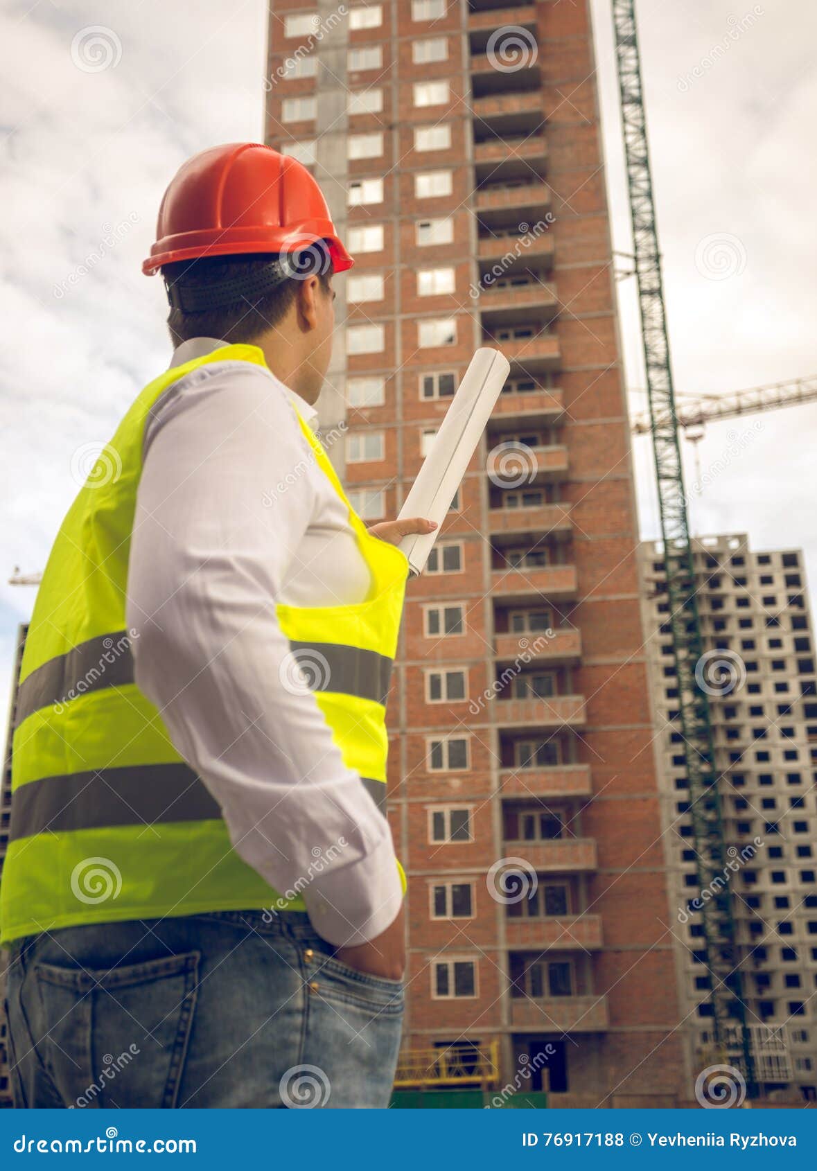 Toned Photo of Construction Engineer Pointing at Building Under Stock ...