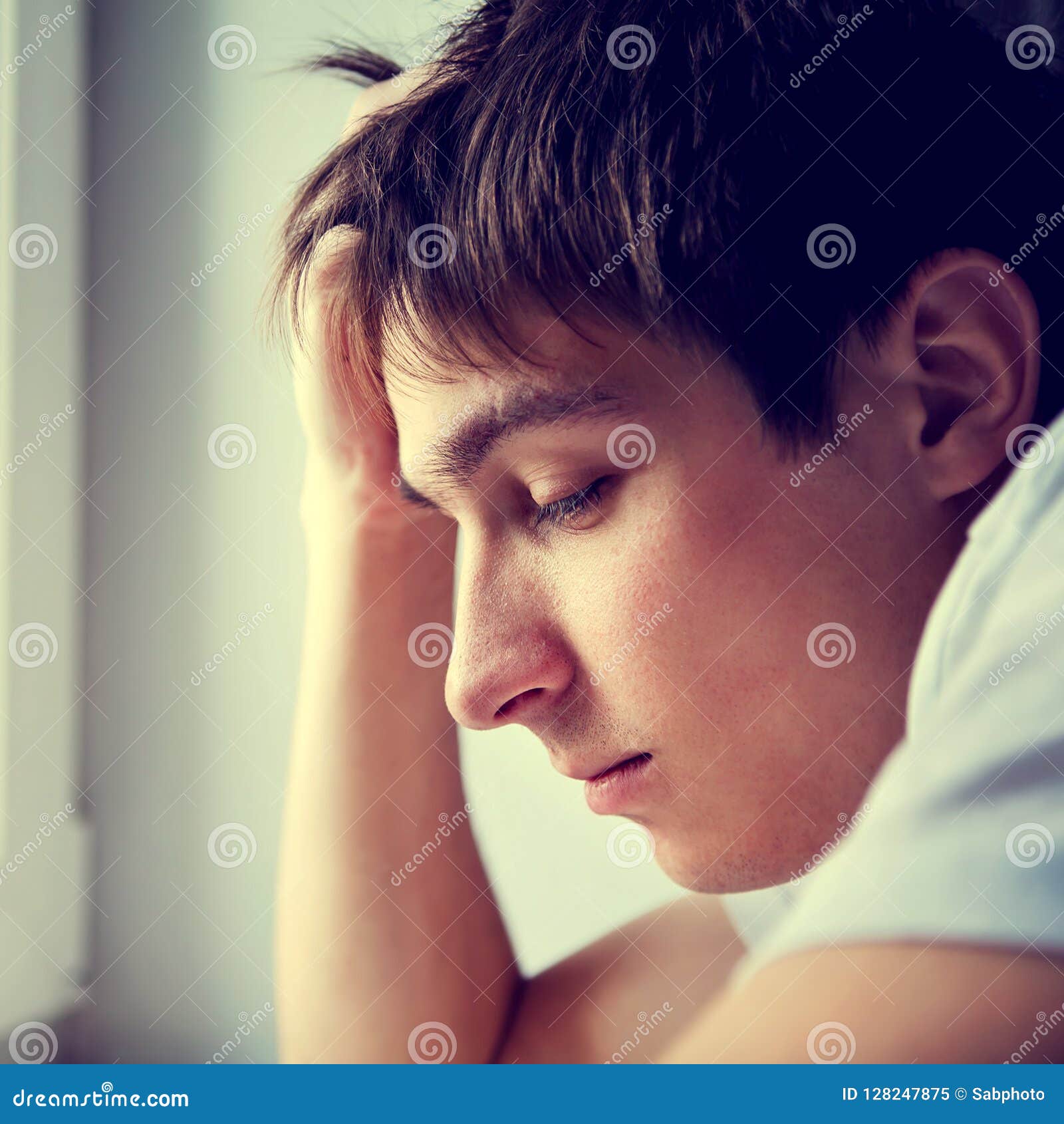 Sad Young Man stock image. Image of heartbroken, grieved - 128247875