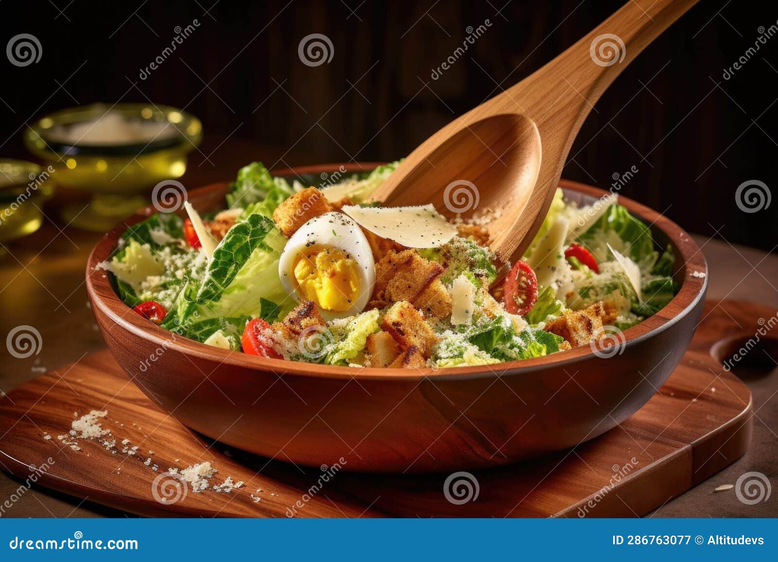 Tongs Mixing a Vibrant Caesar Salad with Dressing Stock Image - Image ...