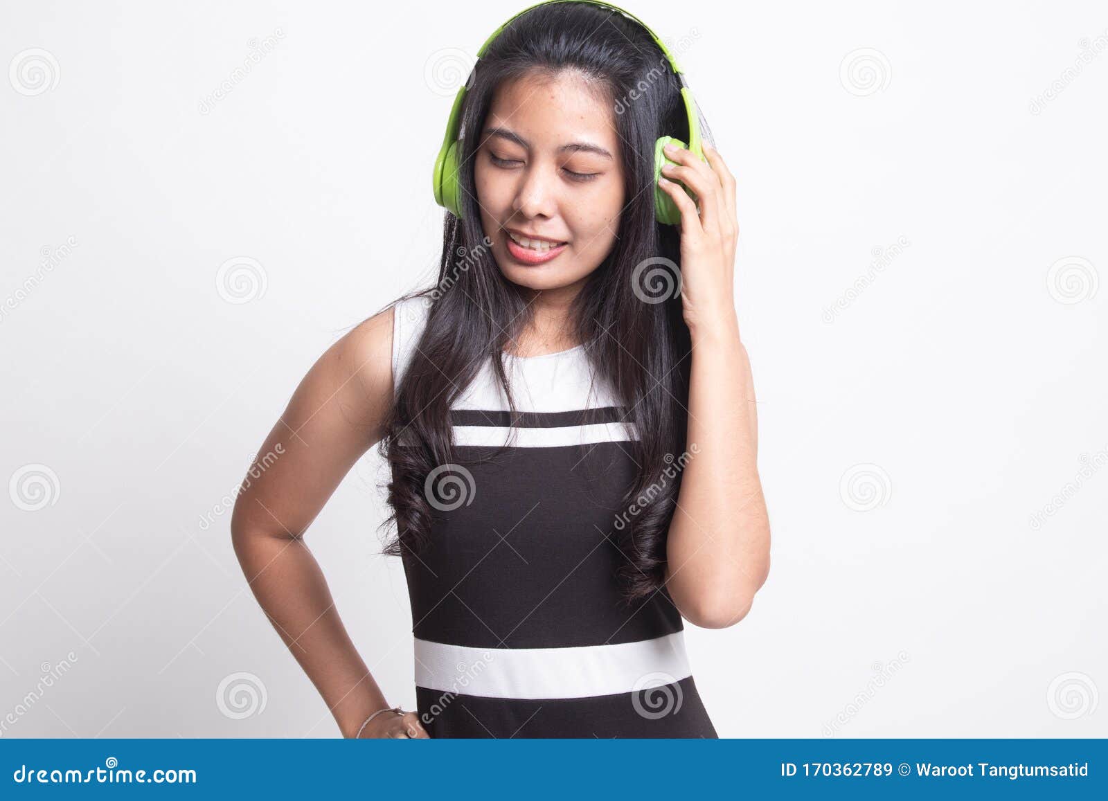 Too Loud. Portrait of Young Asian Woman Holding Headphones and Making ... Too Loud. Portrait of Young Asian Woman Holding Headphones and Making ...