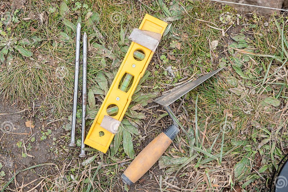 Tools in an Archaeological Excavation, Nails, Hand Level and Trowel ...