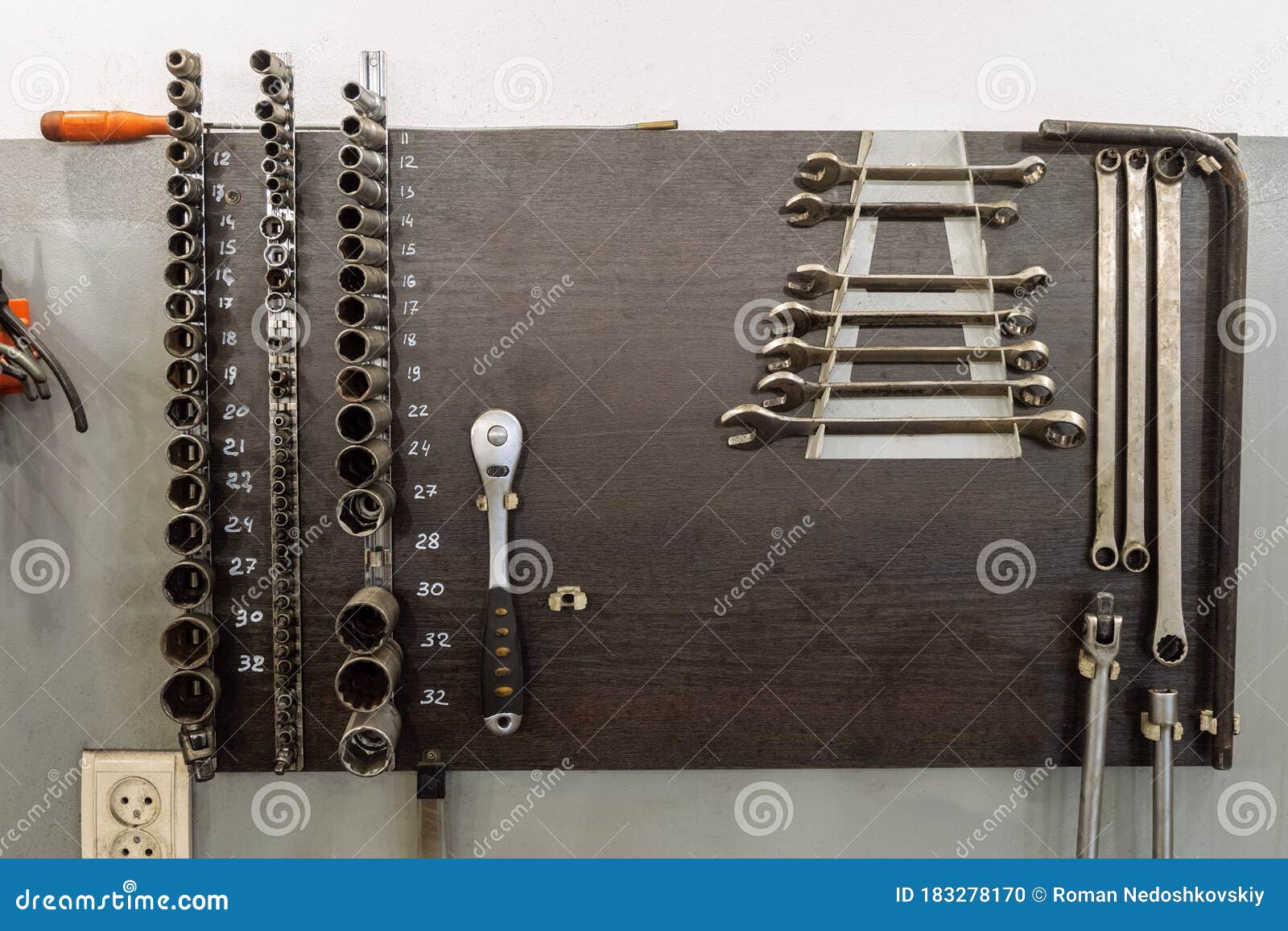 Tools on the Board. Spanners Hanging on Wall in Workshop Stock Photo ...