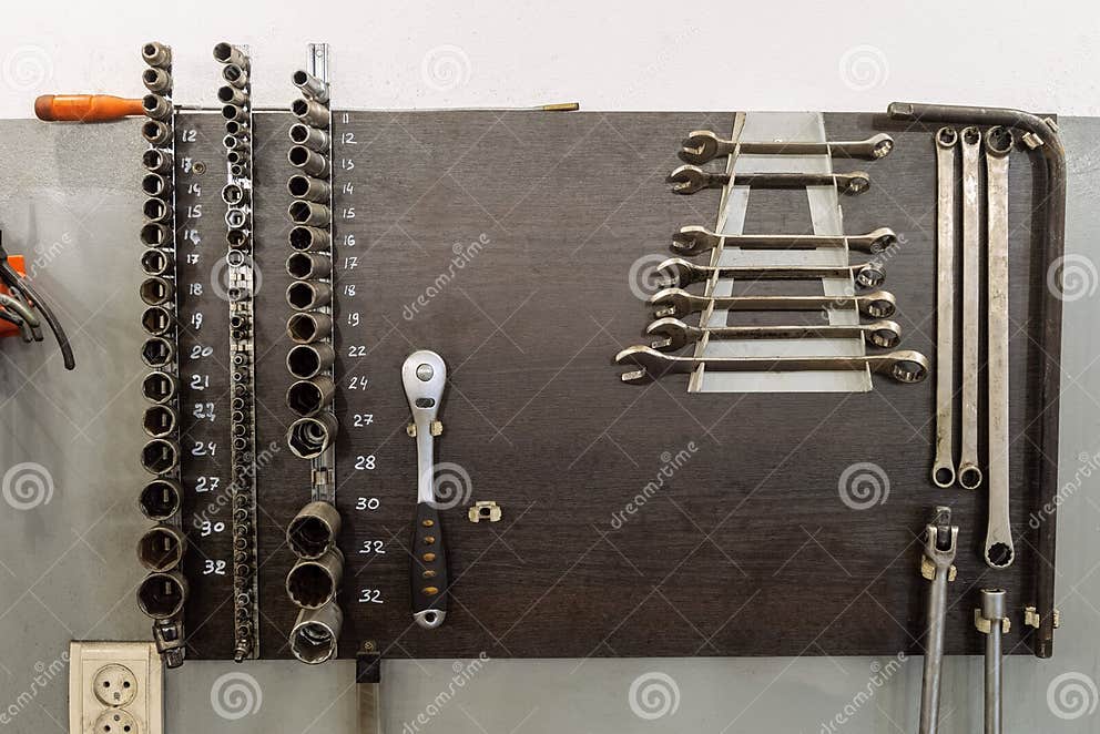 Tools on the Board. Spanners Hanging on Wall in Workshop Stock Photo ...