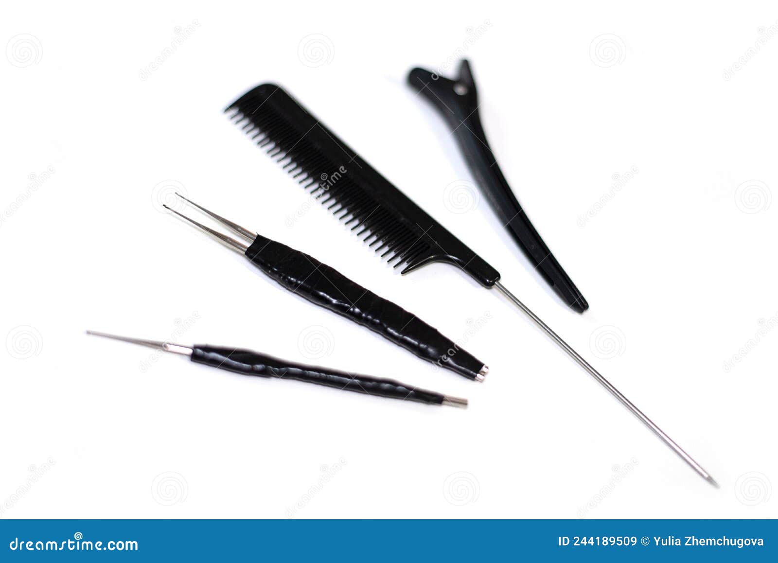 Tools for Braiding Dreadlocks on a White Background. Hooks, Comb and ...