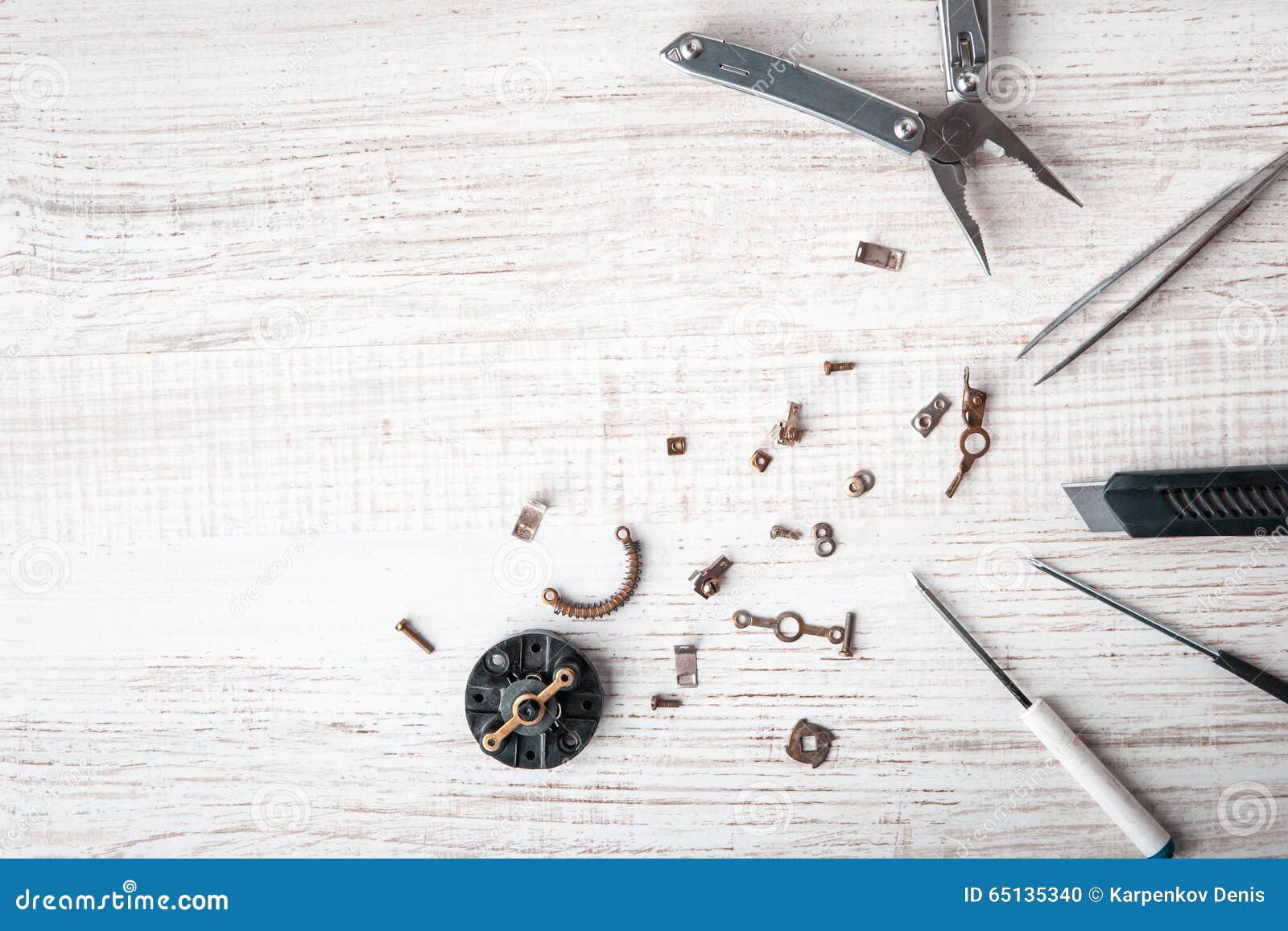 Tools and Disassembled Mechanism on the Desktop Stock Photo - Image of ...