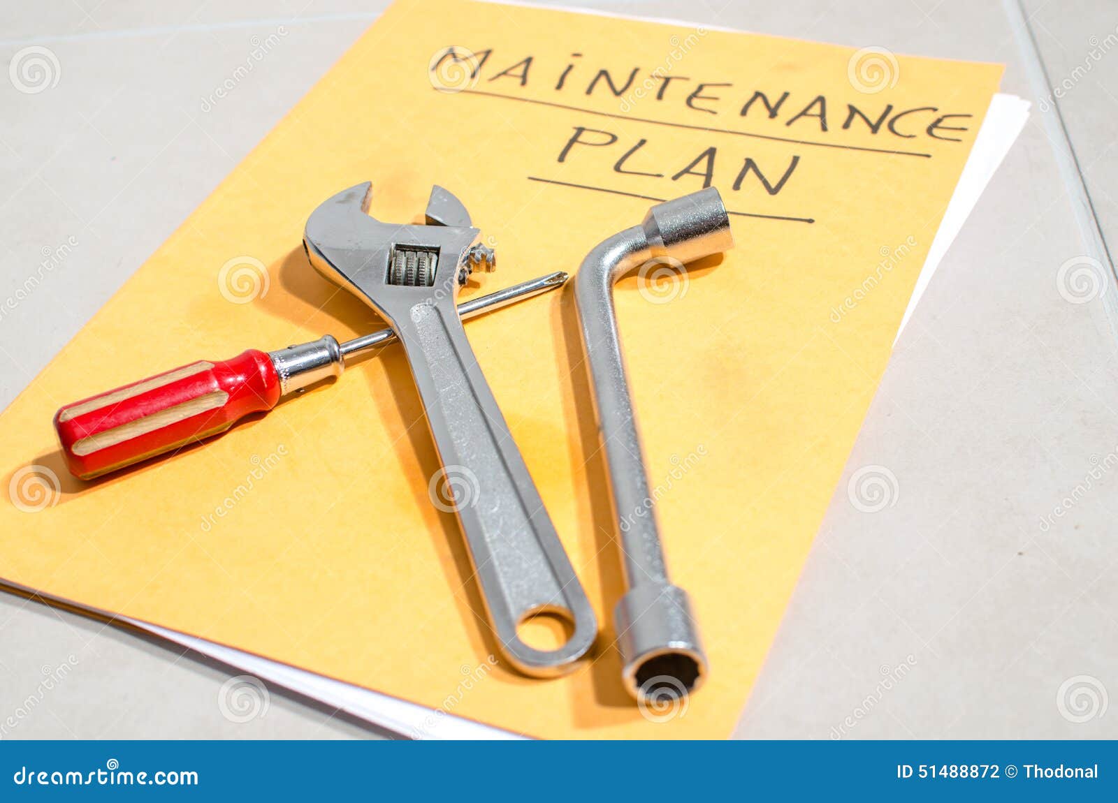 Tools on a Folder of Maintenance Plan Stock Photo - Image of report ...