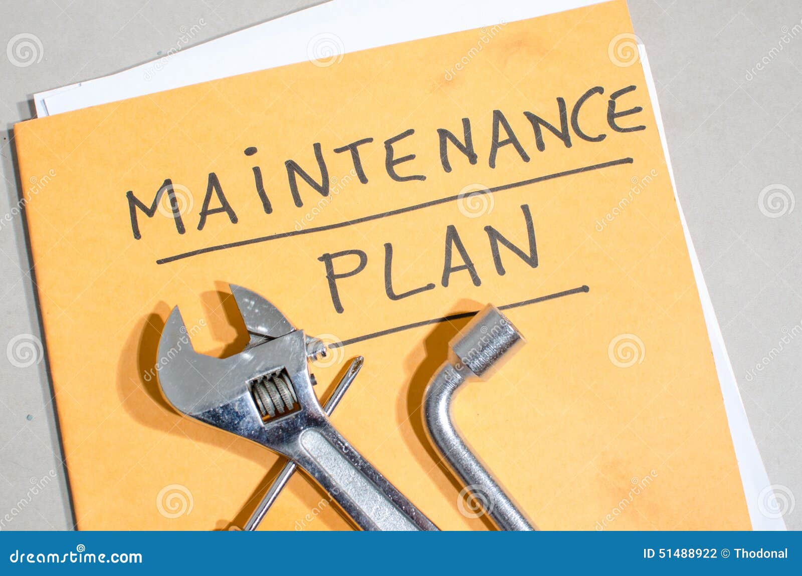 Tools on a Folder of Maintenance Plan Stock Photo - Image of report ...