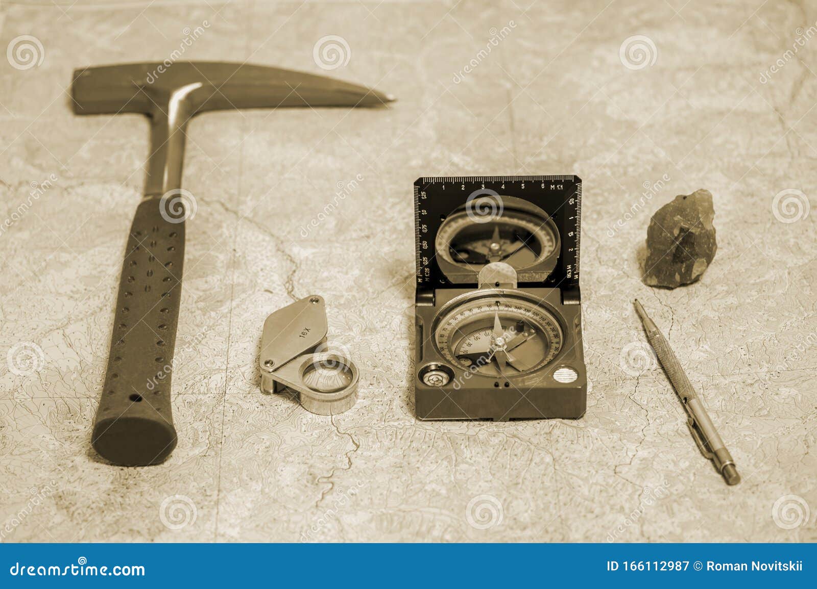 The Tools of the Geologist Laid Out on a Topographic Map. Background ...