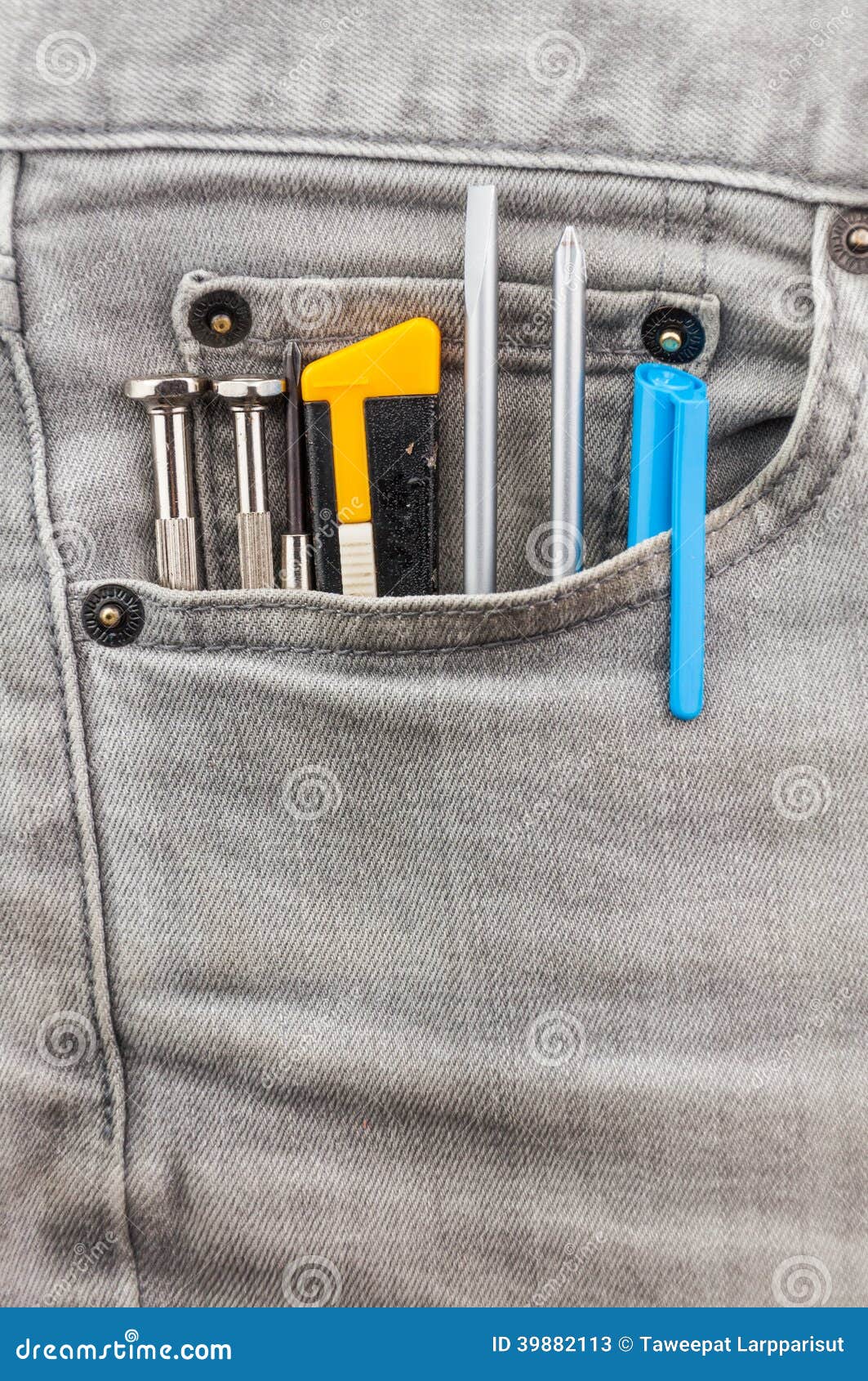 Tools in grey jean pocket stock image. Image of jeans - 39882113