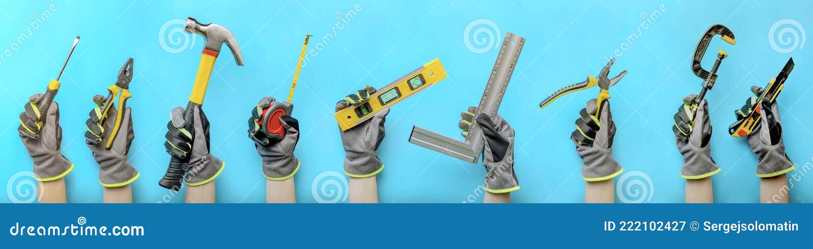 Tools in Hand. Hands Hold Construction and Carpentry Tools, on a Blue ...