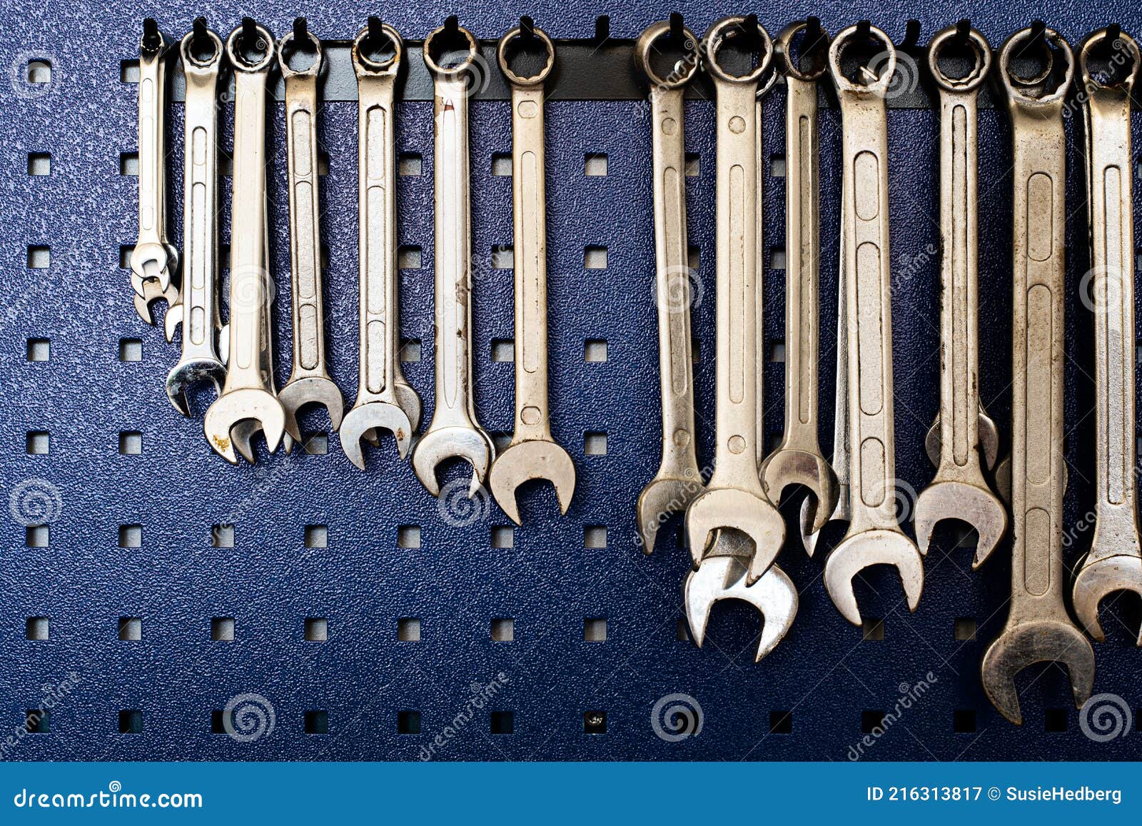 Set of Wrenches on the Blue Wall Stock Image - Image of factory, silver ...