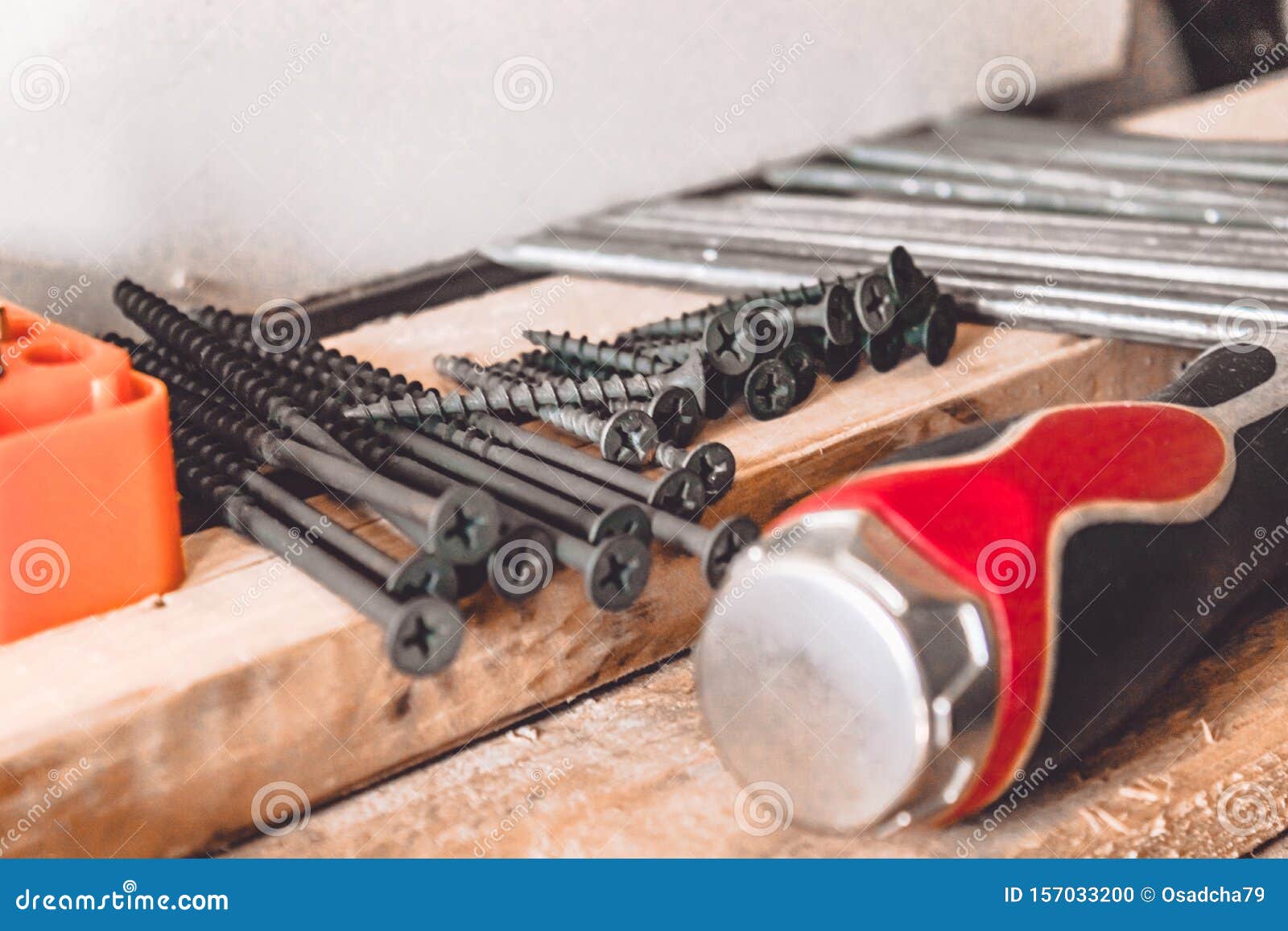 Tools for the Job. Screws, Nails and a Screwdriver are on the Table ...