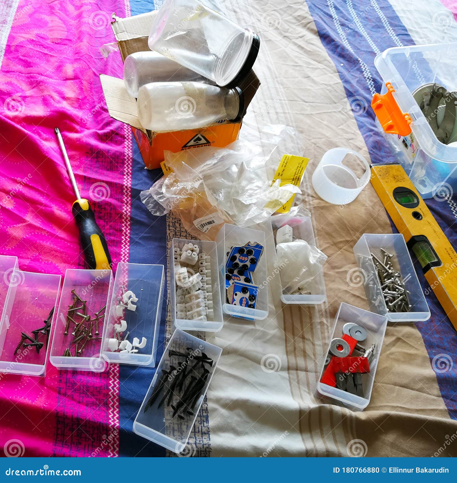 Tools Organizing Process into Containers at Home on the Bed Stock Photo ...