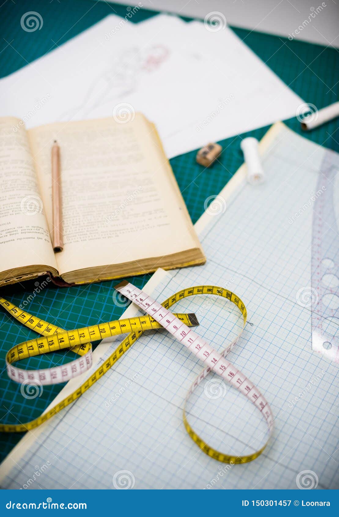Tools, Patterns and Fabric Samples on the Sewing Table in the Tailor ...