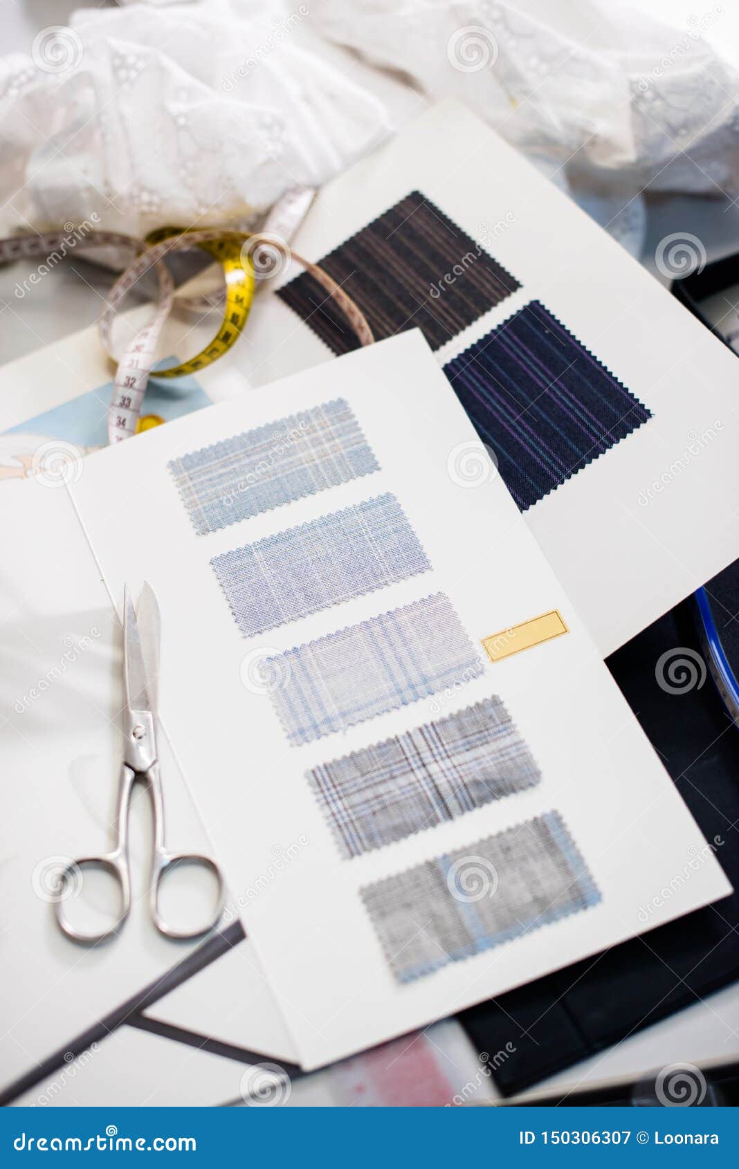 Tools, Patterns and Fabric Samples on the Sewing Table in the Tailor ...