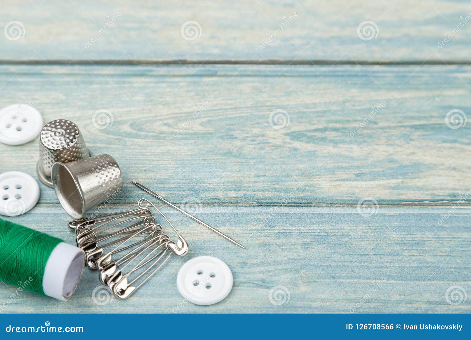 Tools for Sewing and Needlework on Green Wooden Background Stock Photo ...