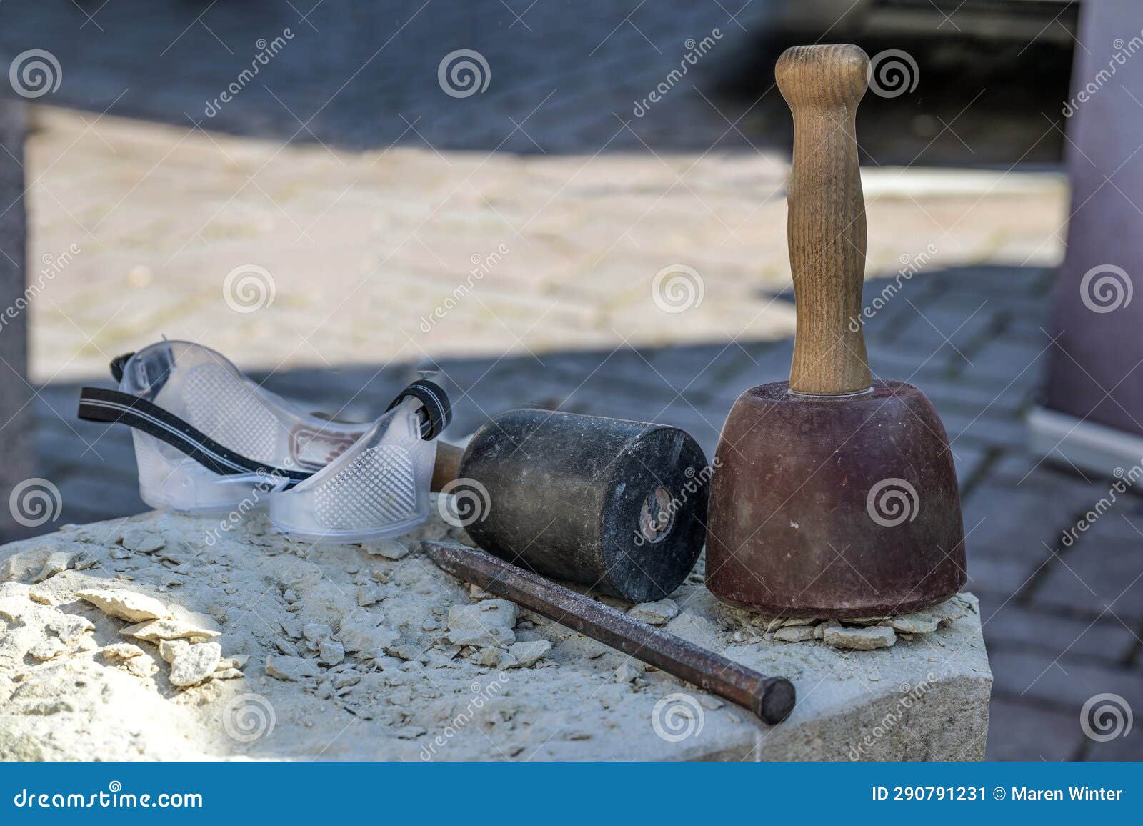 Tools From A Stonemason Consisting Of Plastic Coated Wooden Mallets