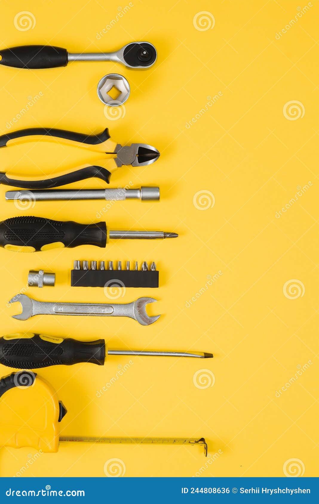 Tools Top View on Yellow Background. Plier, Open Wrenches, Screwdrivers ...