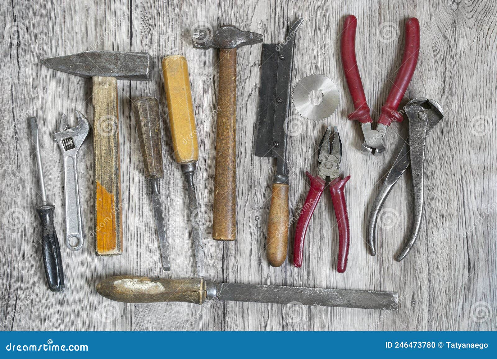 Tools on wood background stock photo. Image of equipment - 246473780