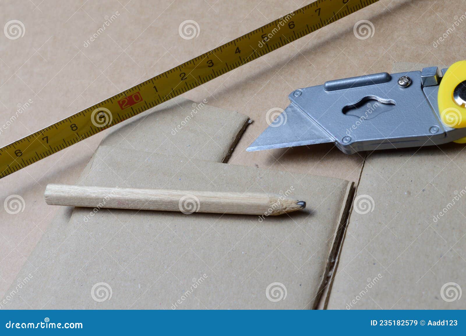 Tools for Working with Cardboard Laid Out on a Table with Cardboard ...