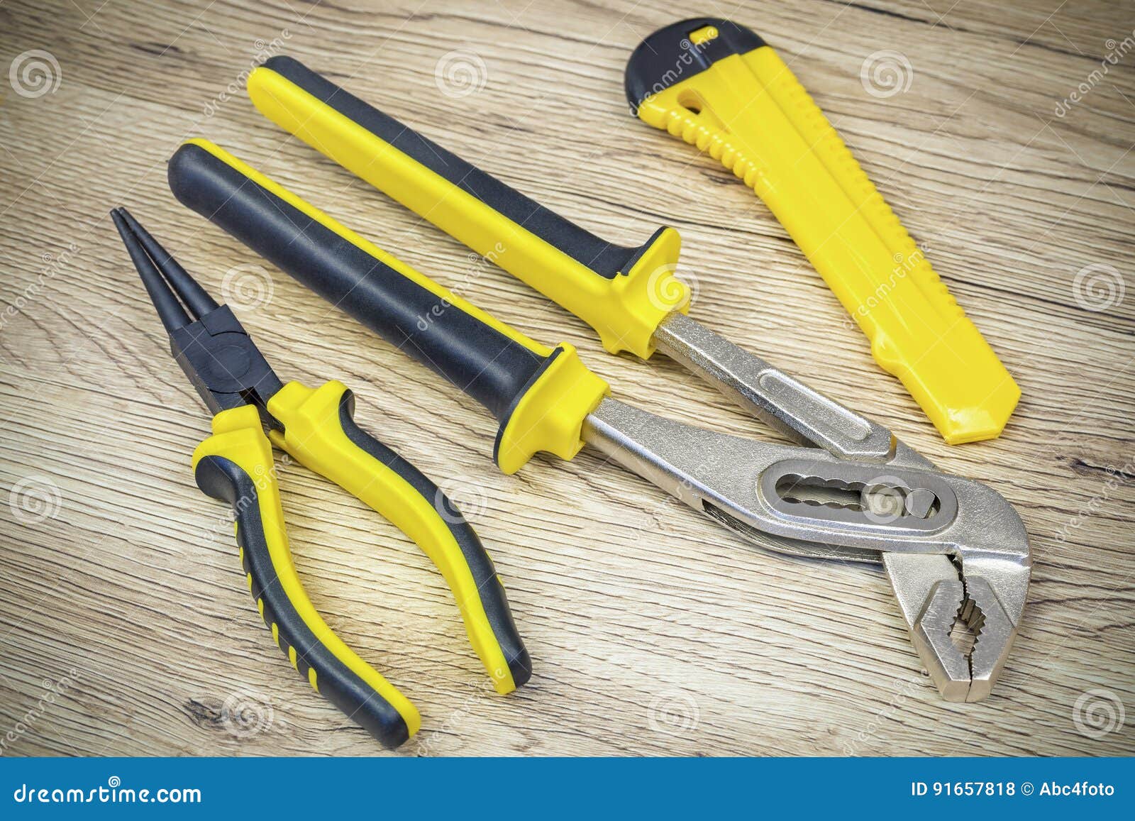 Tools in yellow on wood stock photo. Image of metal, industrial - 91657818