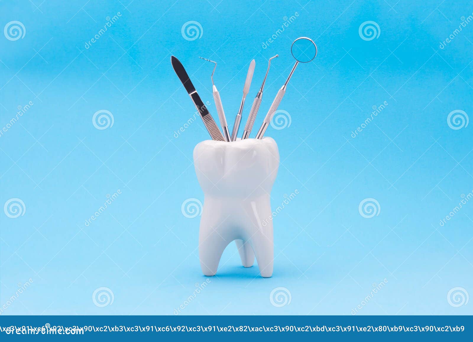 Tooth Model in the Form of a Stand with Dental Instruments Inside. the ...