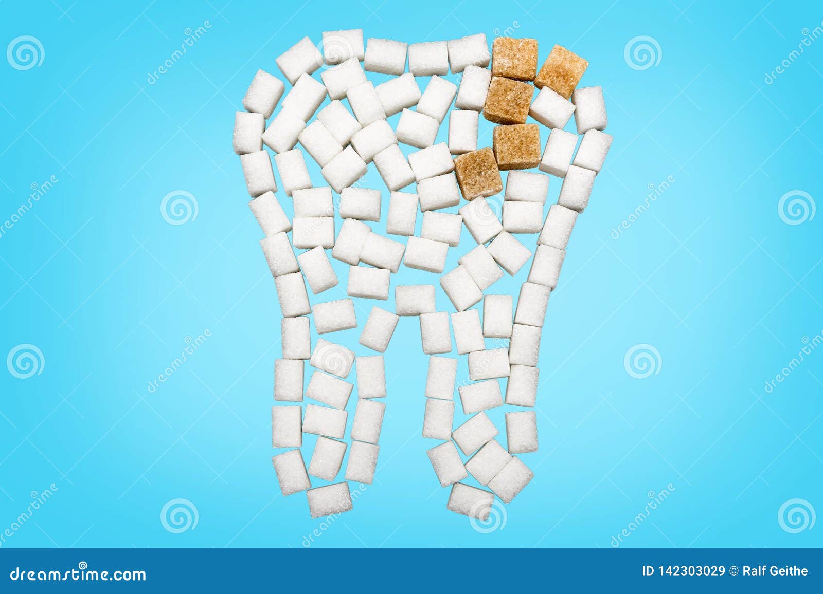 Tooth of Sugar Cubes with Caries in Front of Blue Background Stock ...