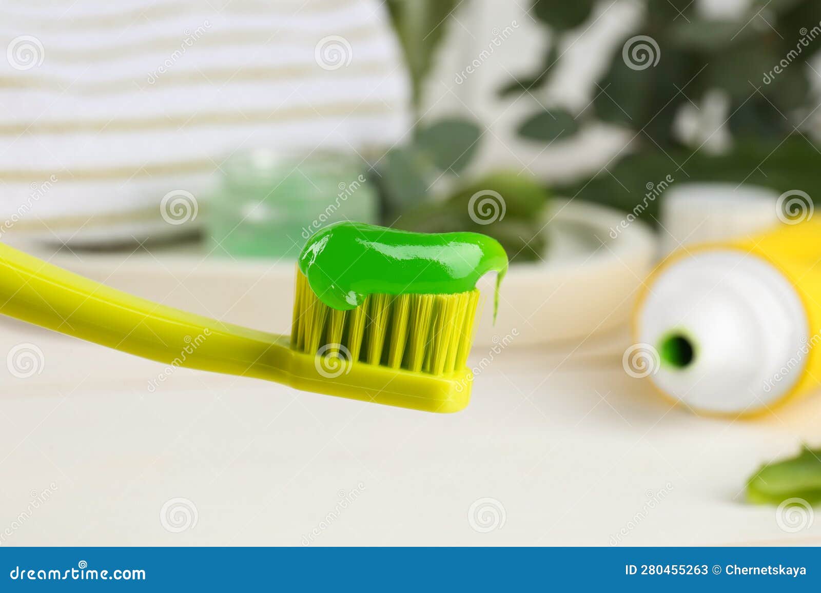 Toothbrush with Aloe Toothpaste on Blurred Background, Closeup Stock ...