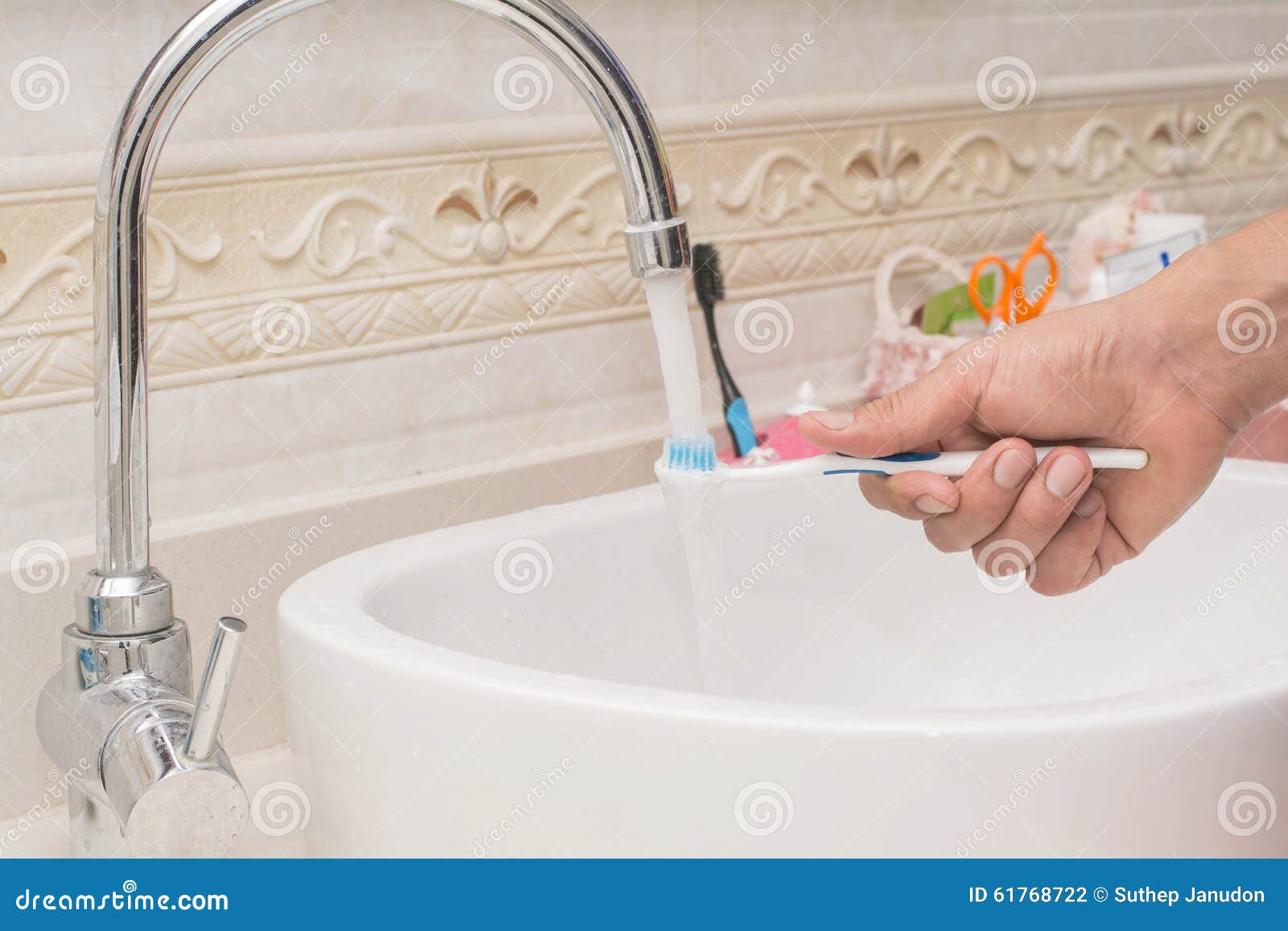 Toothbrush being washed stock photo. Image of brush, blue - 61768722