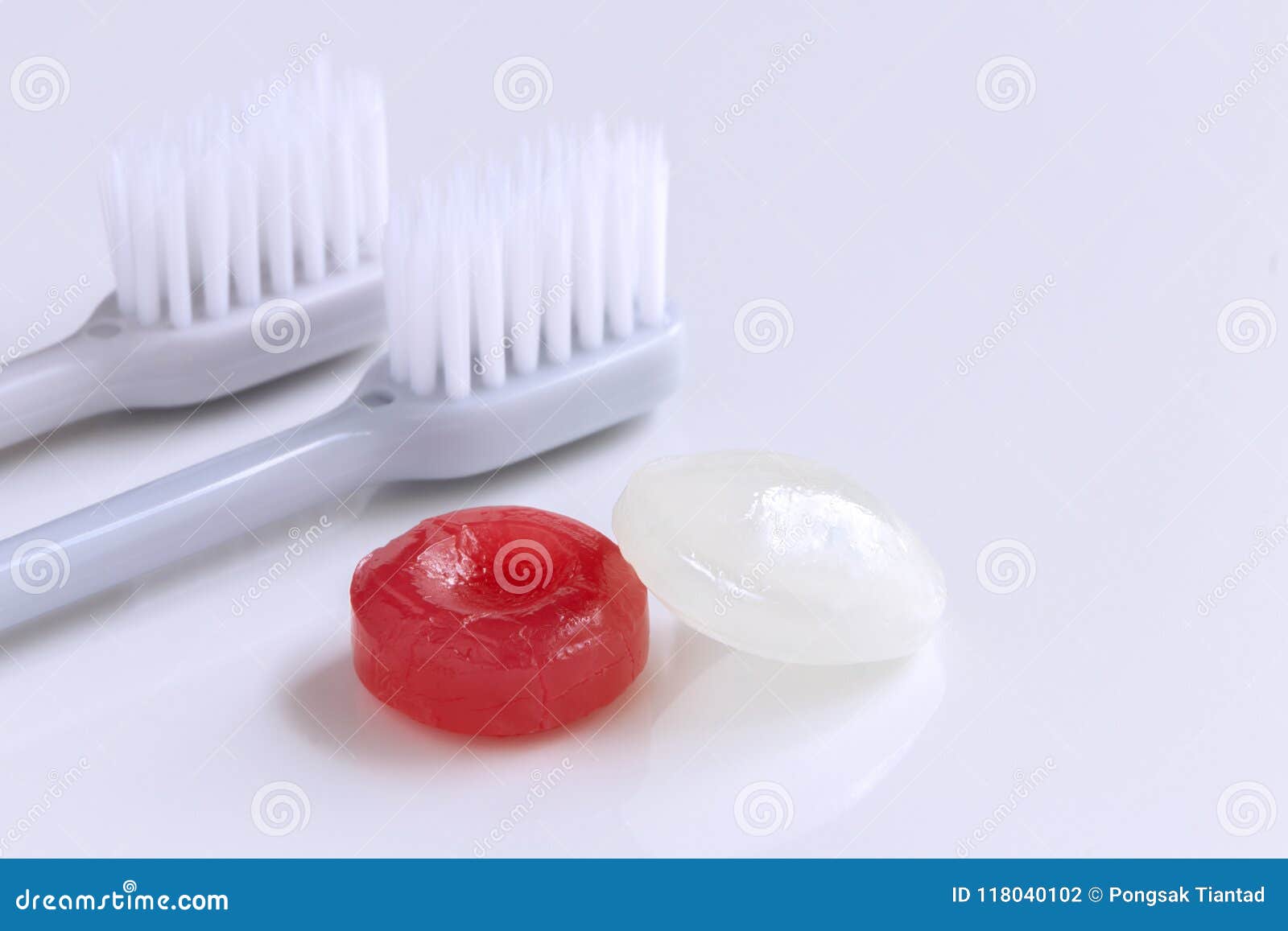 Toothbrush and Candy on the White Table. Stock Photo - Image of dentist ...