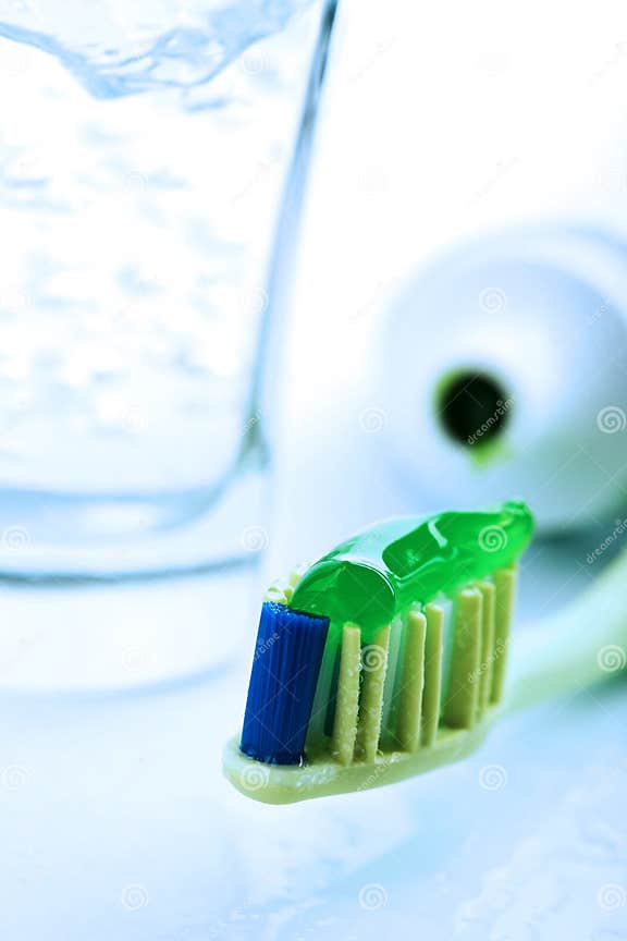 Toothbrush with Green Toothpaste Stock Photo - Image of press, glass ...