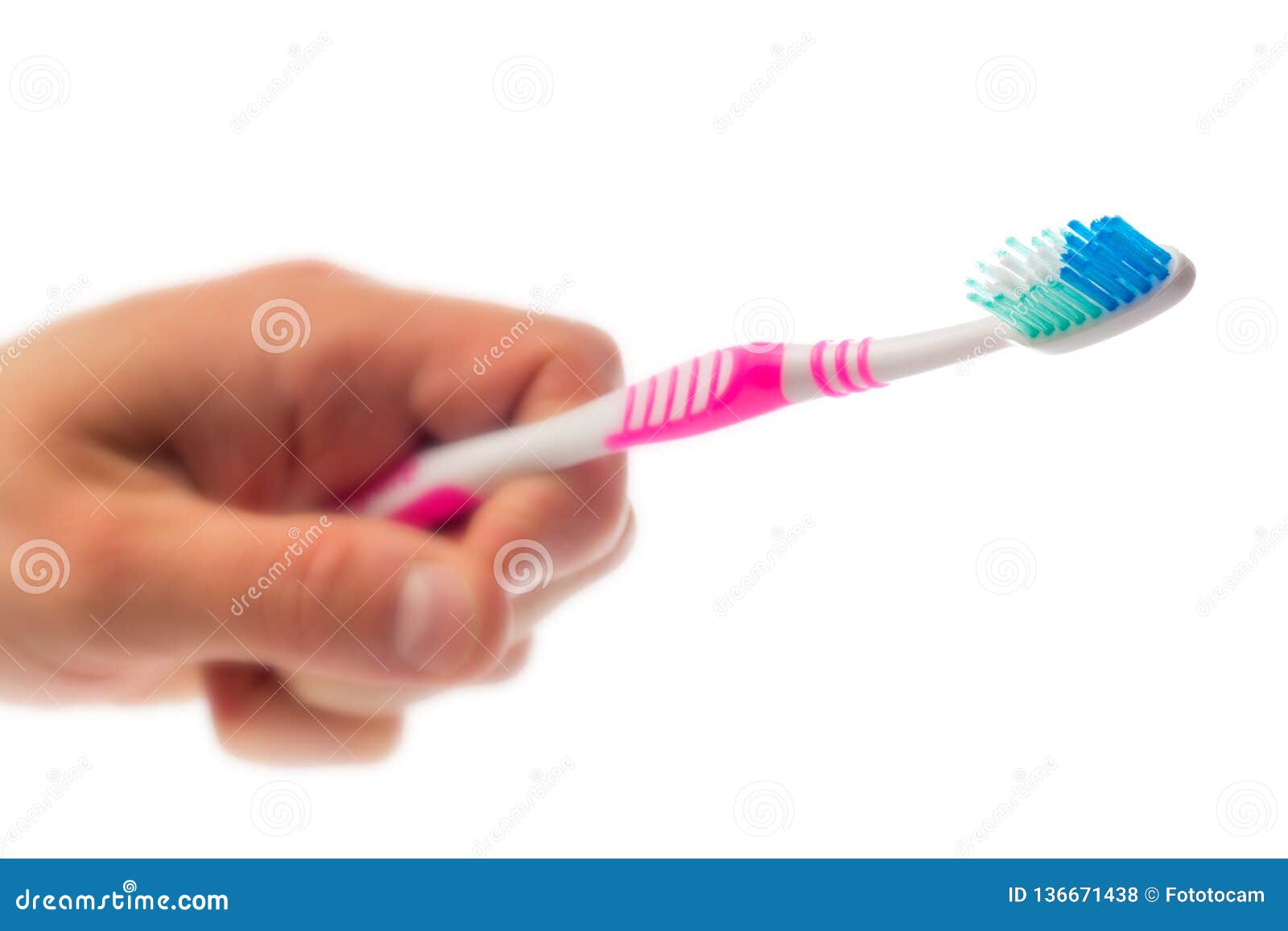 Toothbrush in Hand on an Isolated Background Stock Photo - Image of ...