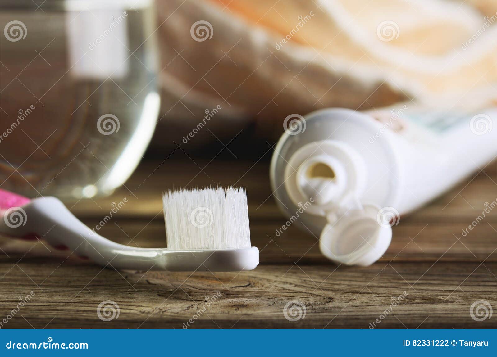 Toothbrush and Open Tube of Toothpaste on a Wooden Table Horizon Stock ...