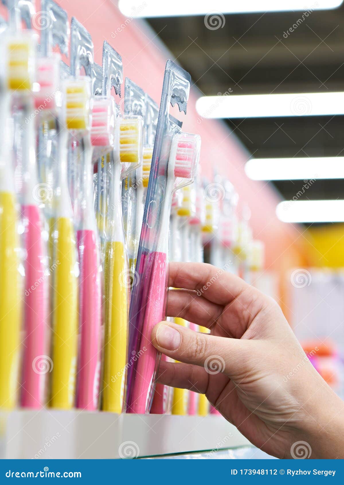 Toothbrush in Package in Hand in Store Stock Photo - Image of pink ...