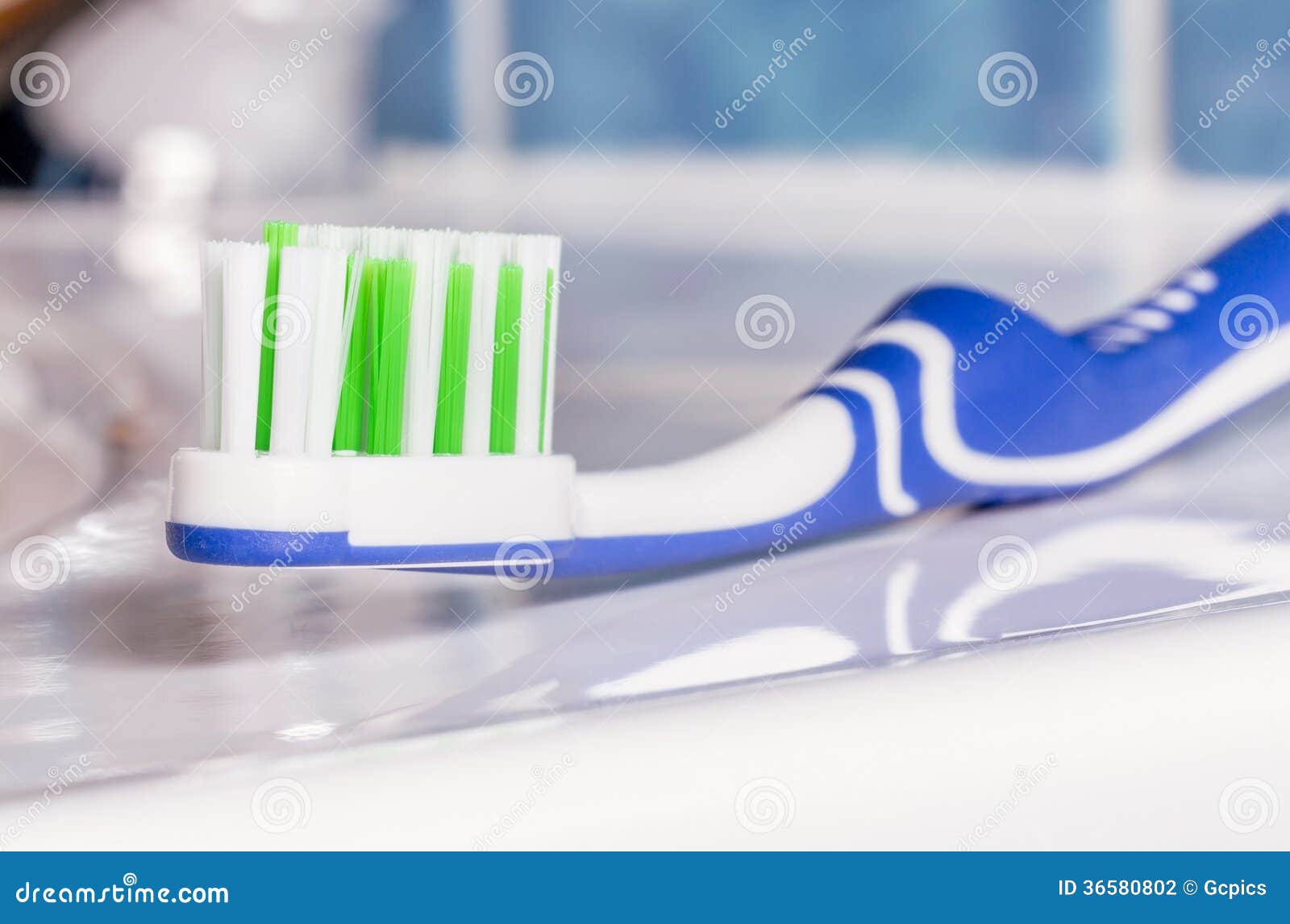 A Toothbrush at the Sink stock photo. Image of brush - 36580802