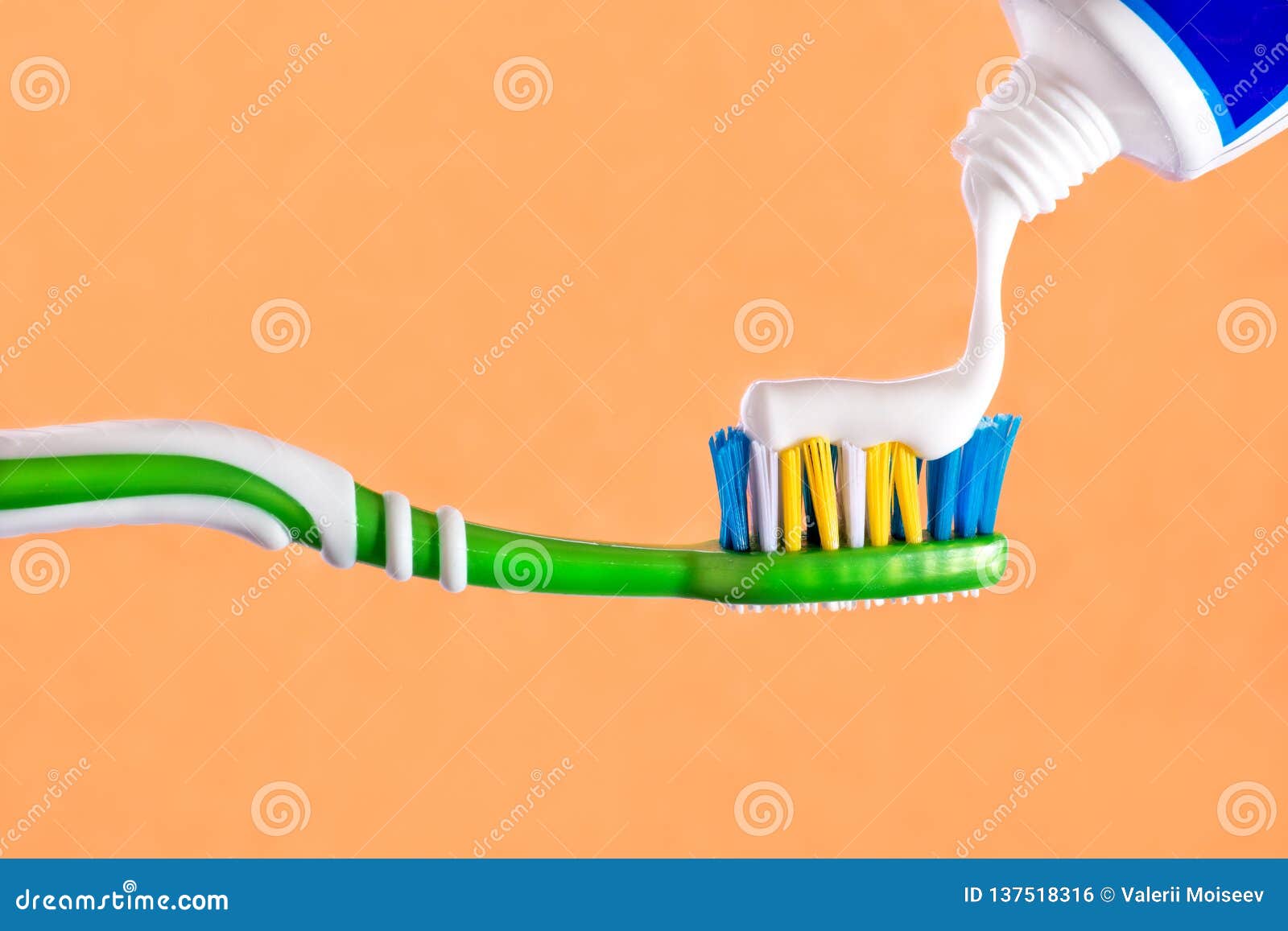 Toothbrush Squeezed on Toothbrush Toothpaste Orange Background Stock ...