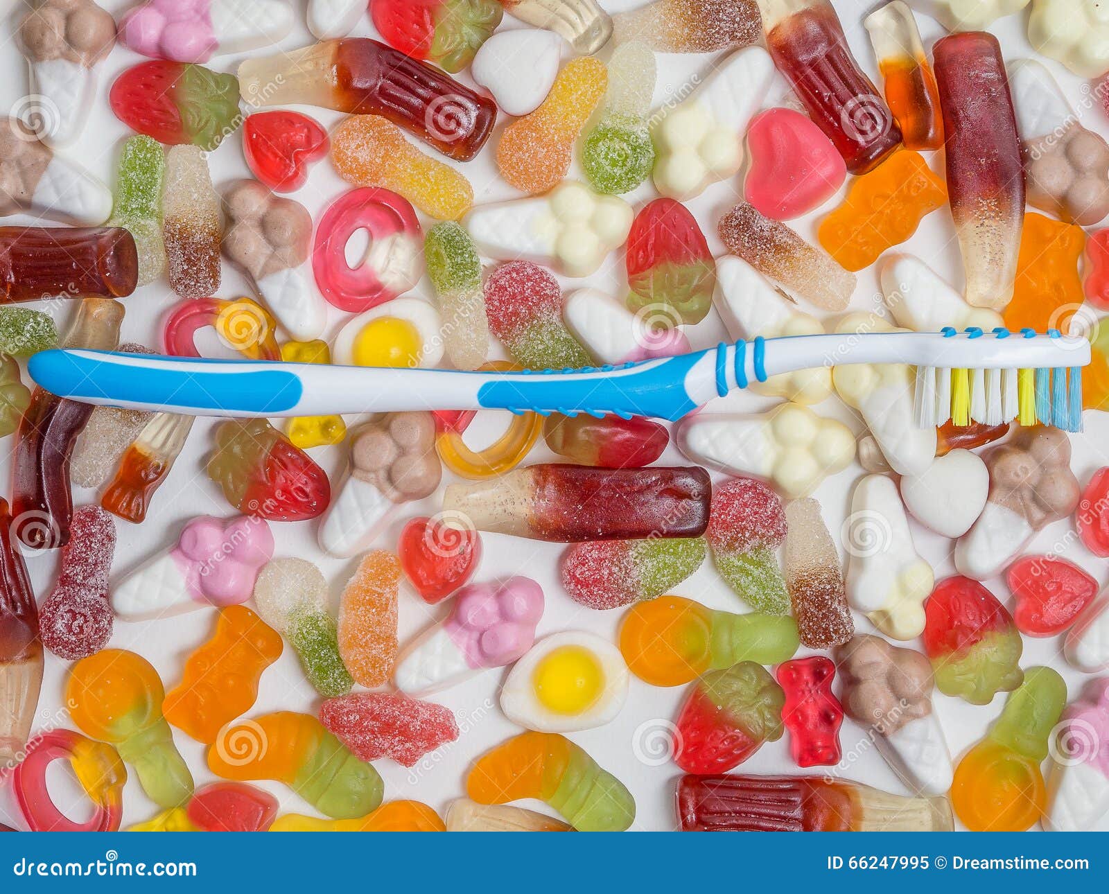 Toothbrush and sweets. stock image. Image of equipment - 66247995