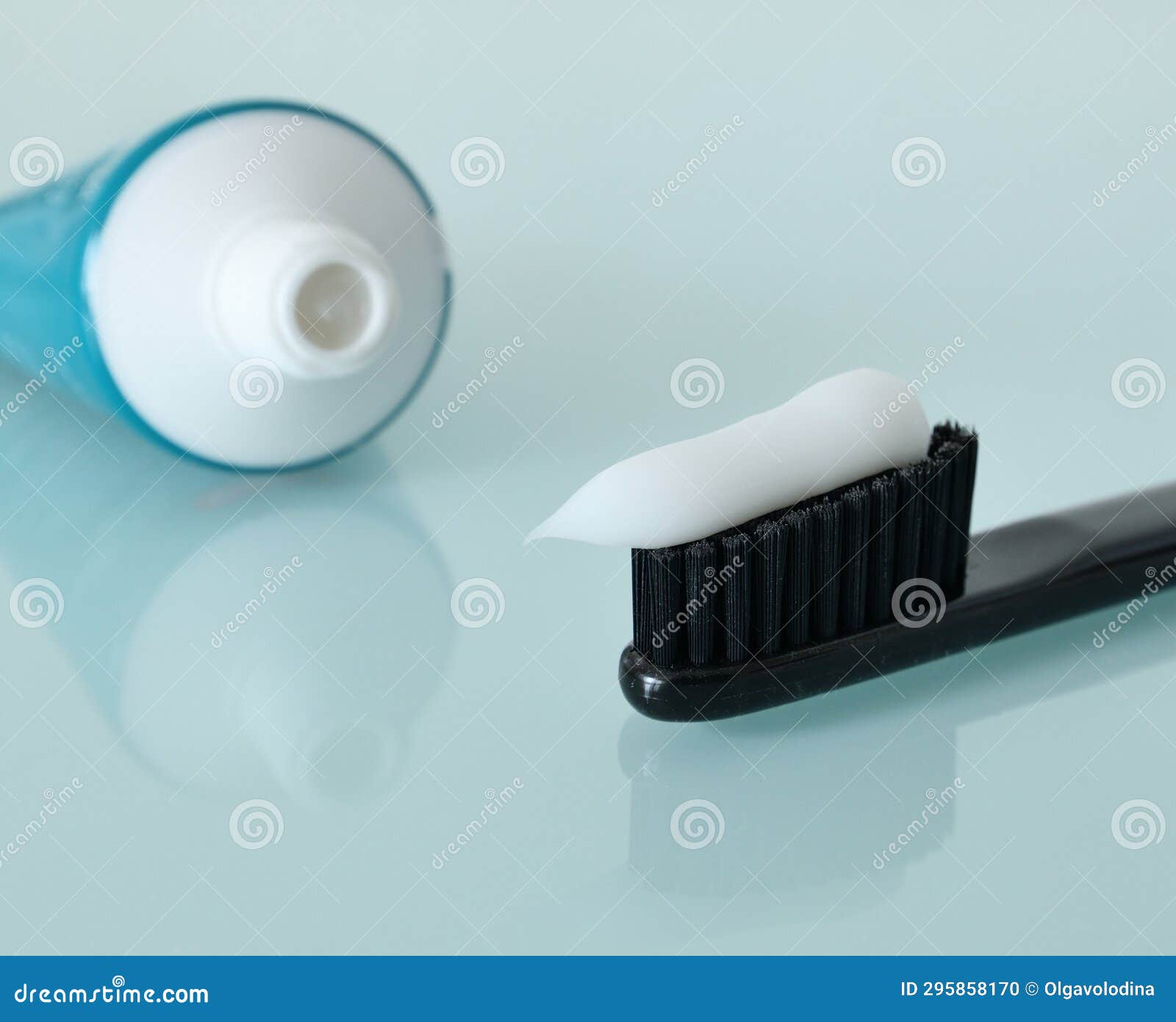 Toothbrush and Toothpaste on a Light Blue Background Stock Photo ...