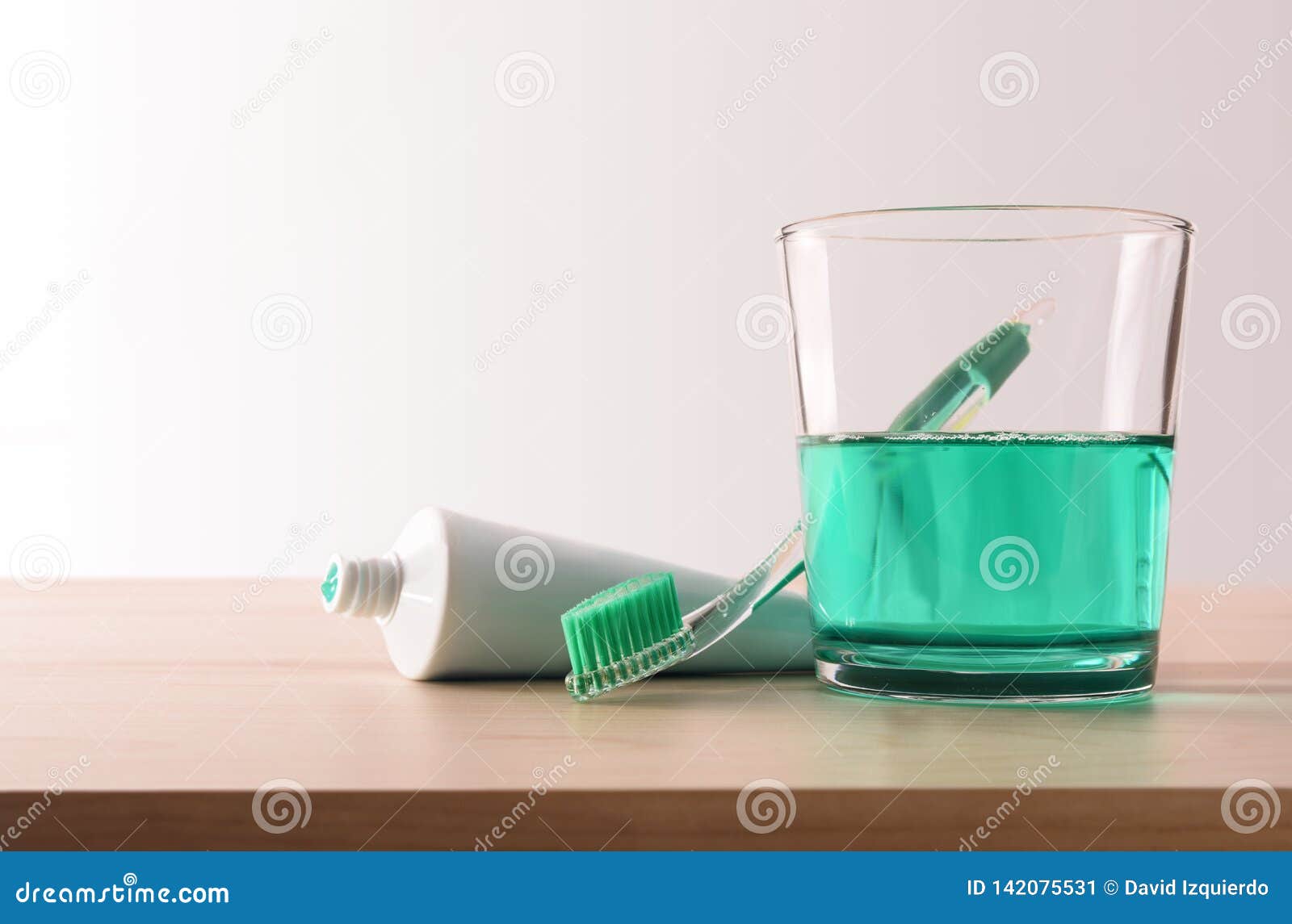 Toothbrush Toothpaste and Mouthwash on the Wooden Table Front View ...