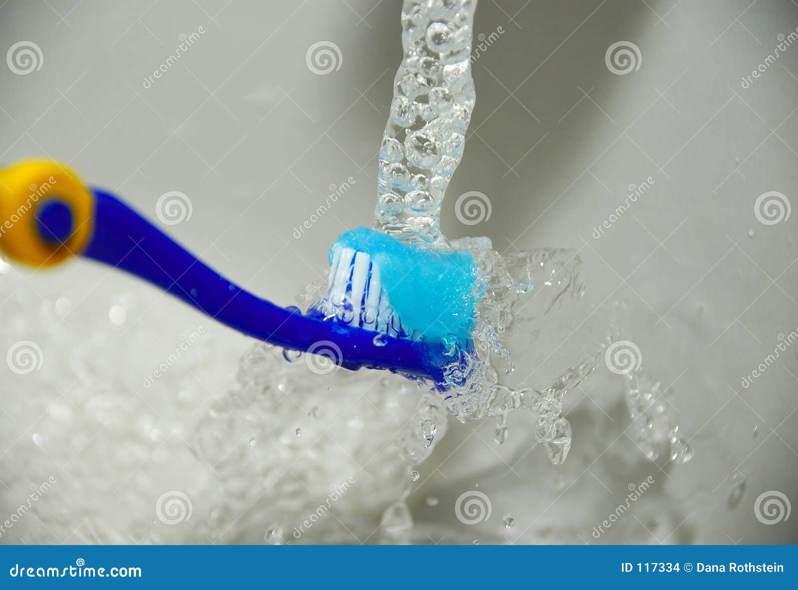 Toothbrush Under Tap stock photo. Image of clean, rinse - 117334