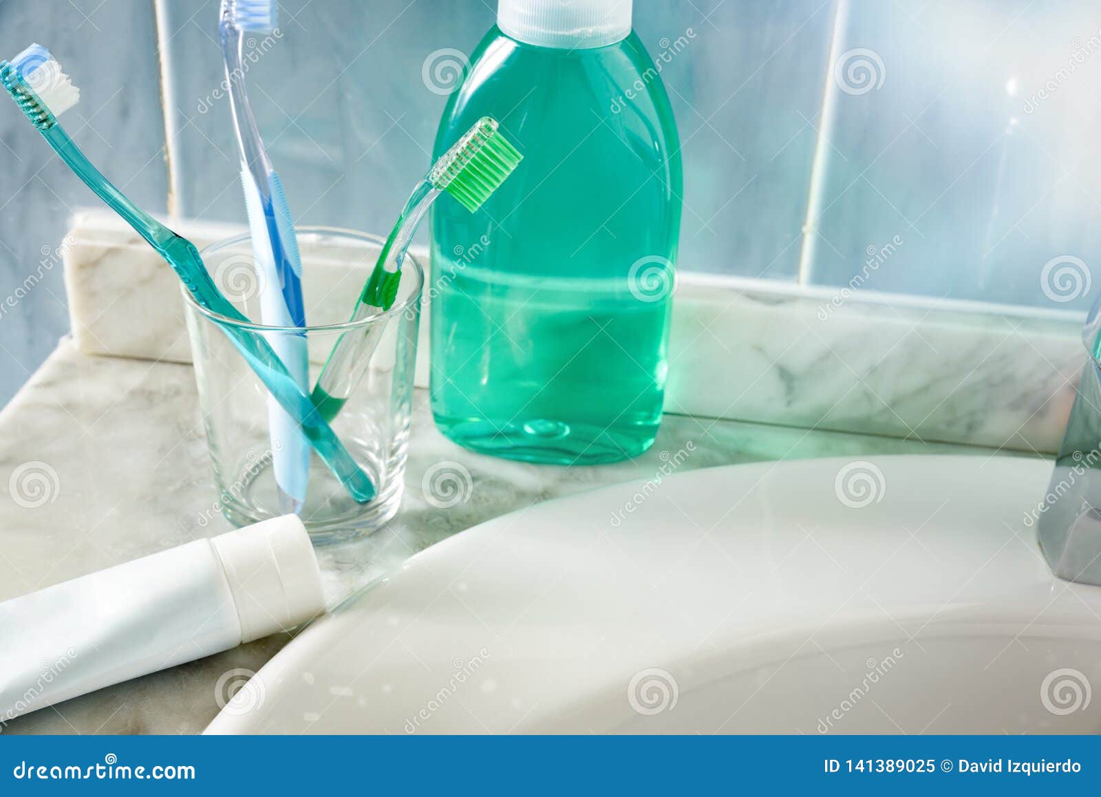 Toothbrushes Toothpaste and Mouthwash on a Sink General View Elevated ...