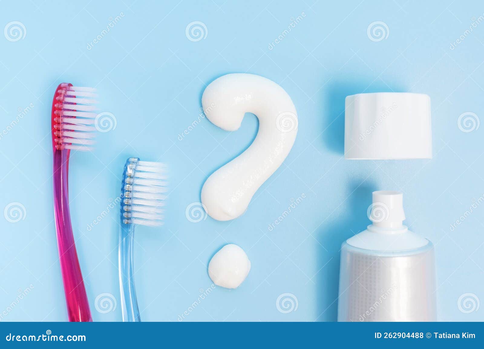 Toothbrushes, Toothpaste and Question Mark on Blue Background Close-up ...